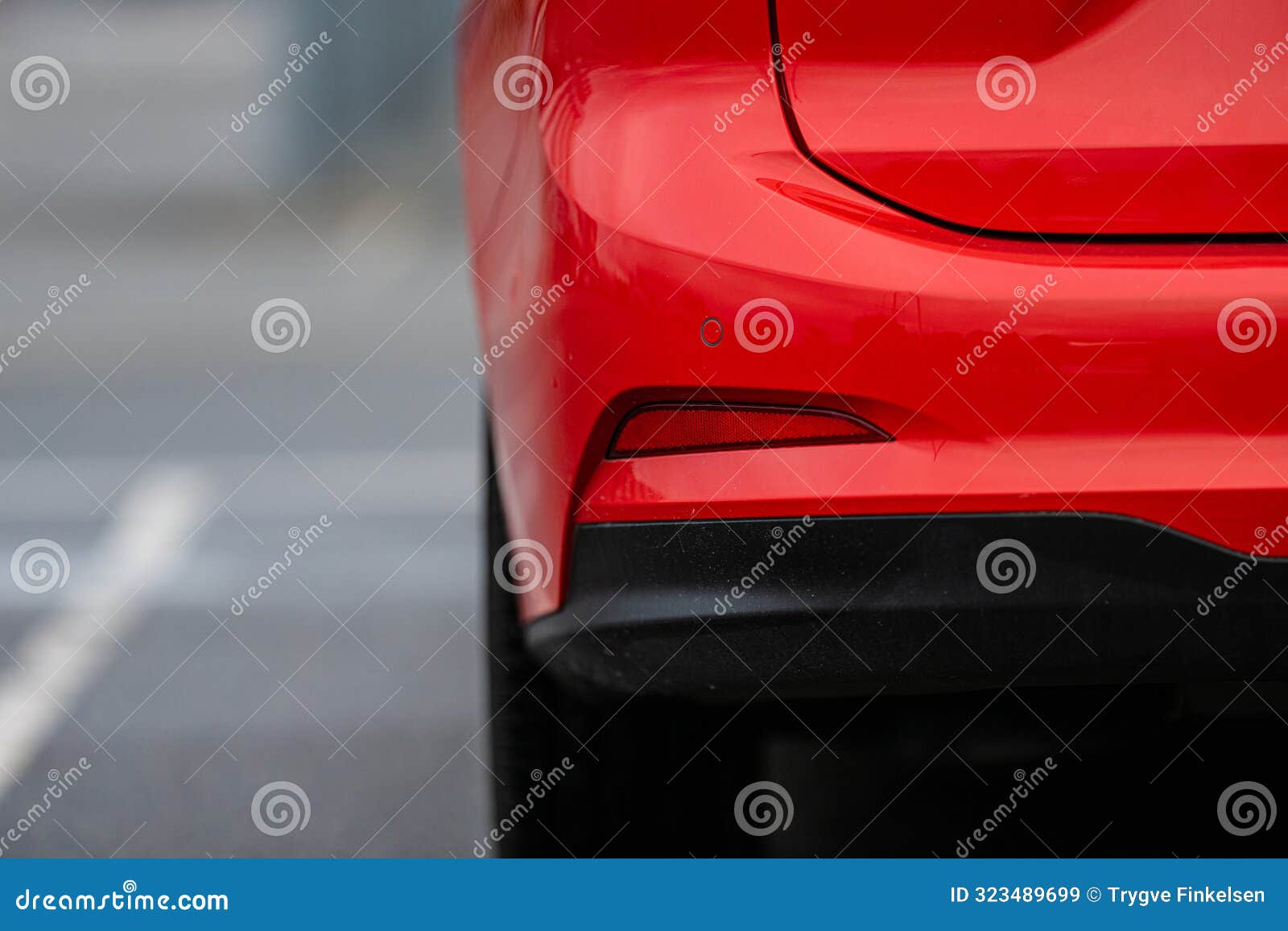 Rear bumper of a red car.. stock image. Image of transportation - 323489699
