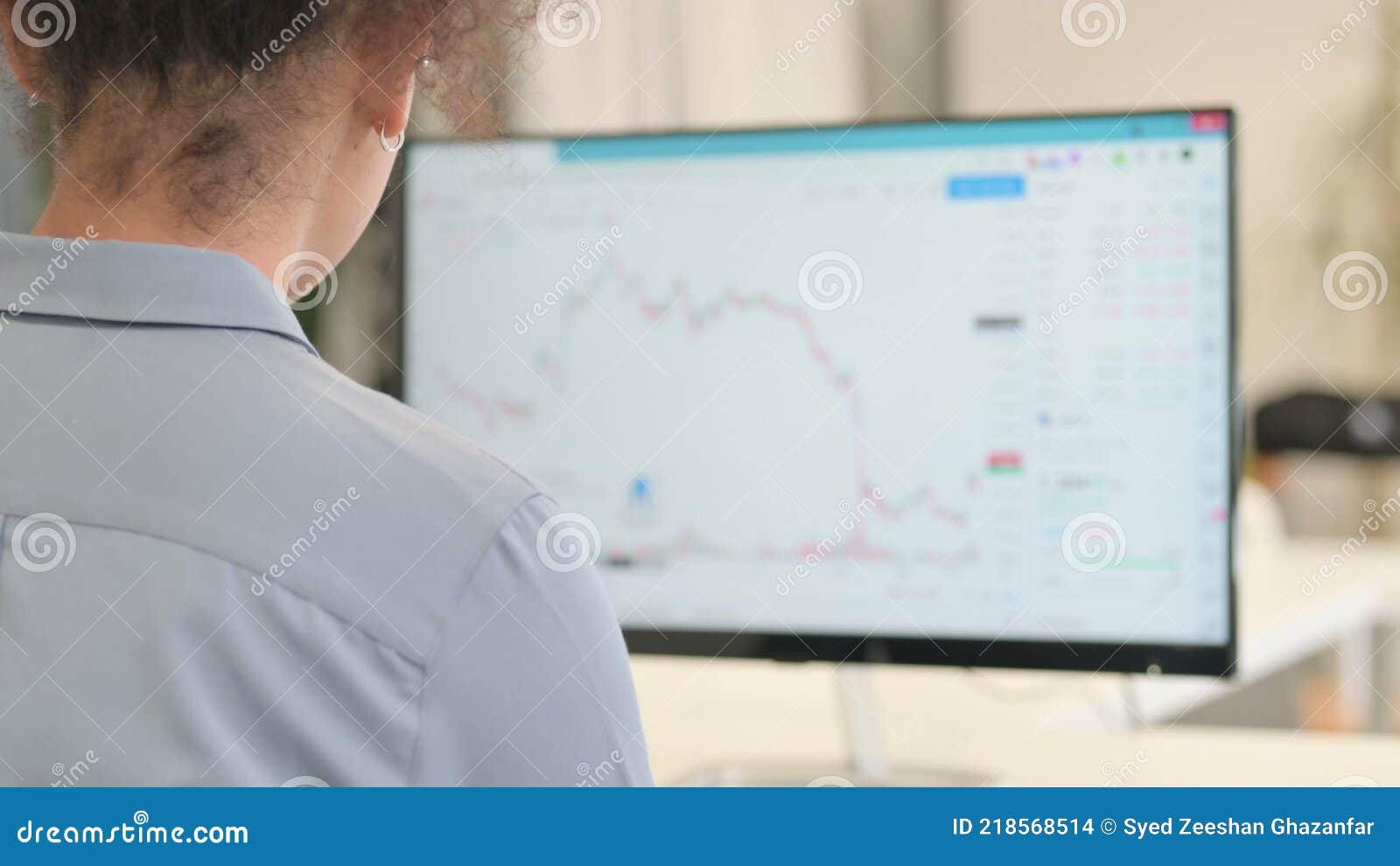 Rear View of African Woman Looking at Charts on Desktop Stock Footage ...
