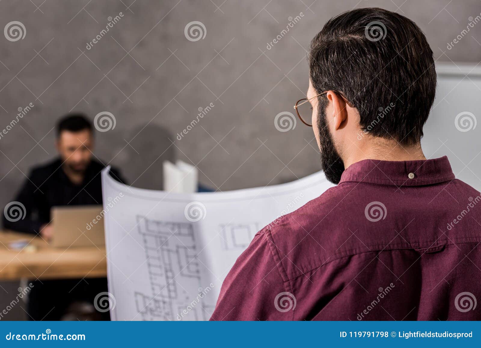 Rear View of Architect Looking at Blueprint Stock Photo - Image of ...
