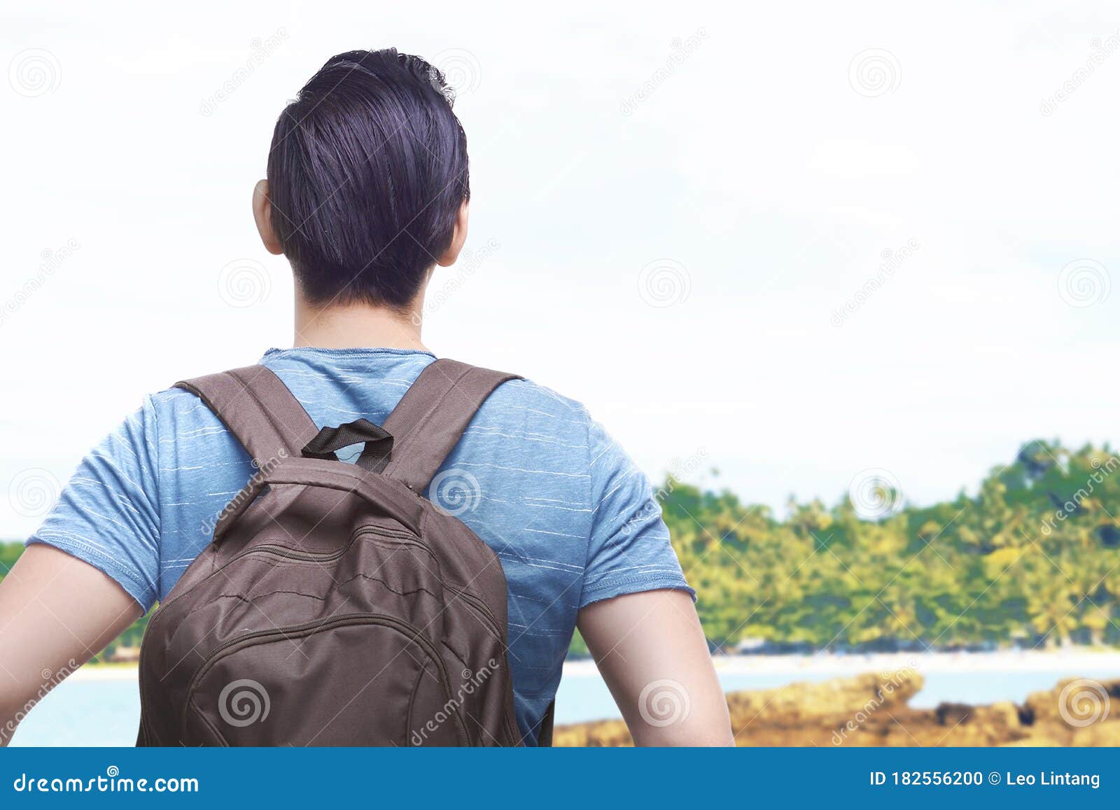 Rear View of an Asian Man with a Backpack Looking at Scenery View Stock ...