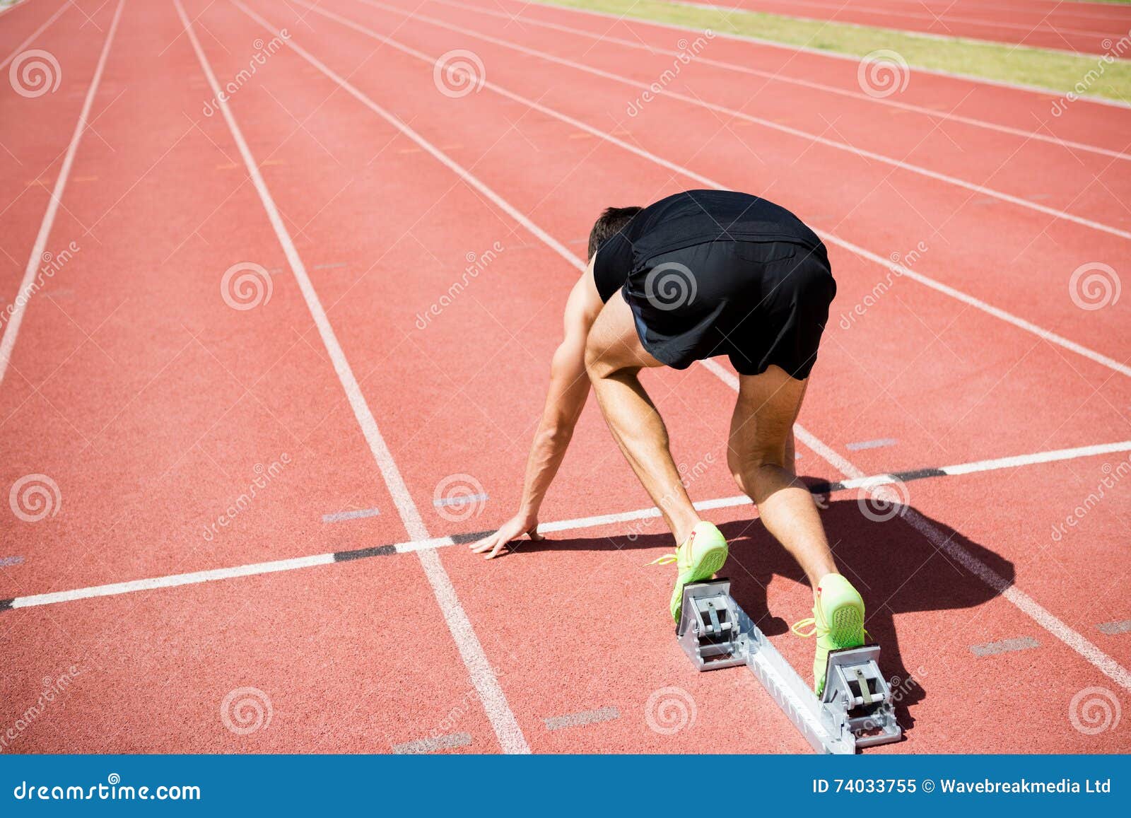 Rear View of an Athlete Ready To Run Stock Image - Image of focused ...