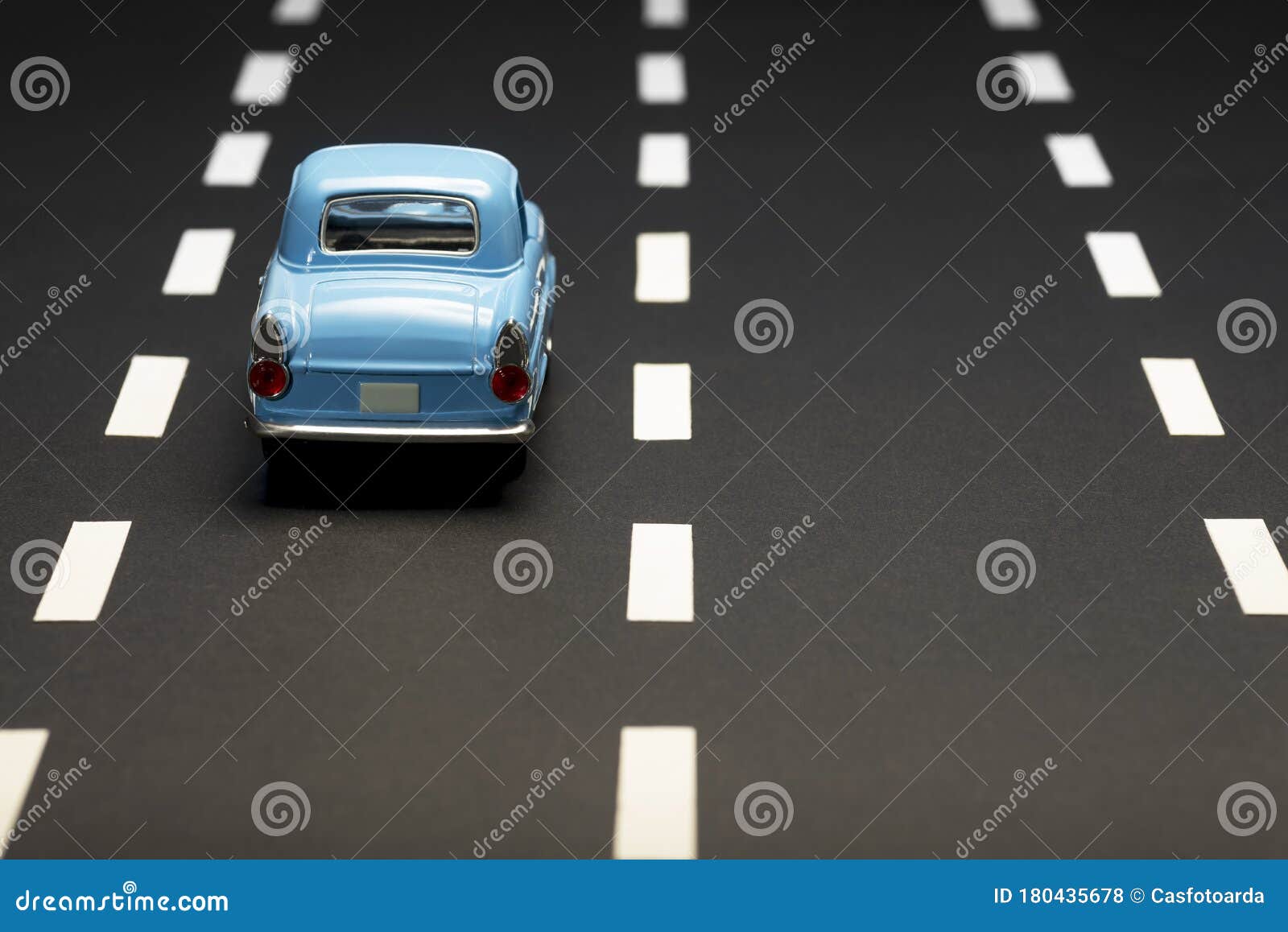 Rear View of a Blue Toy Car on an Asphalt Road Stock Photo - Image of ...