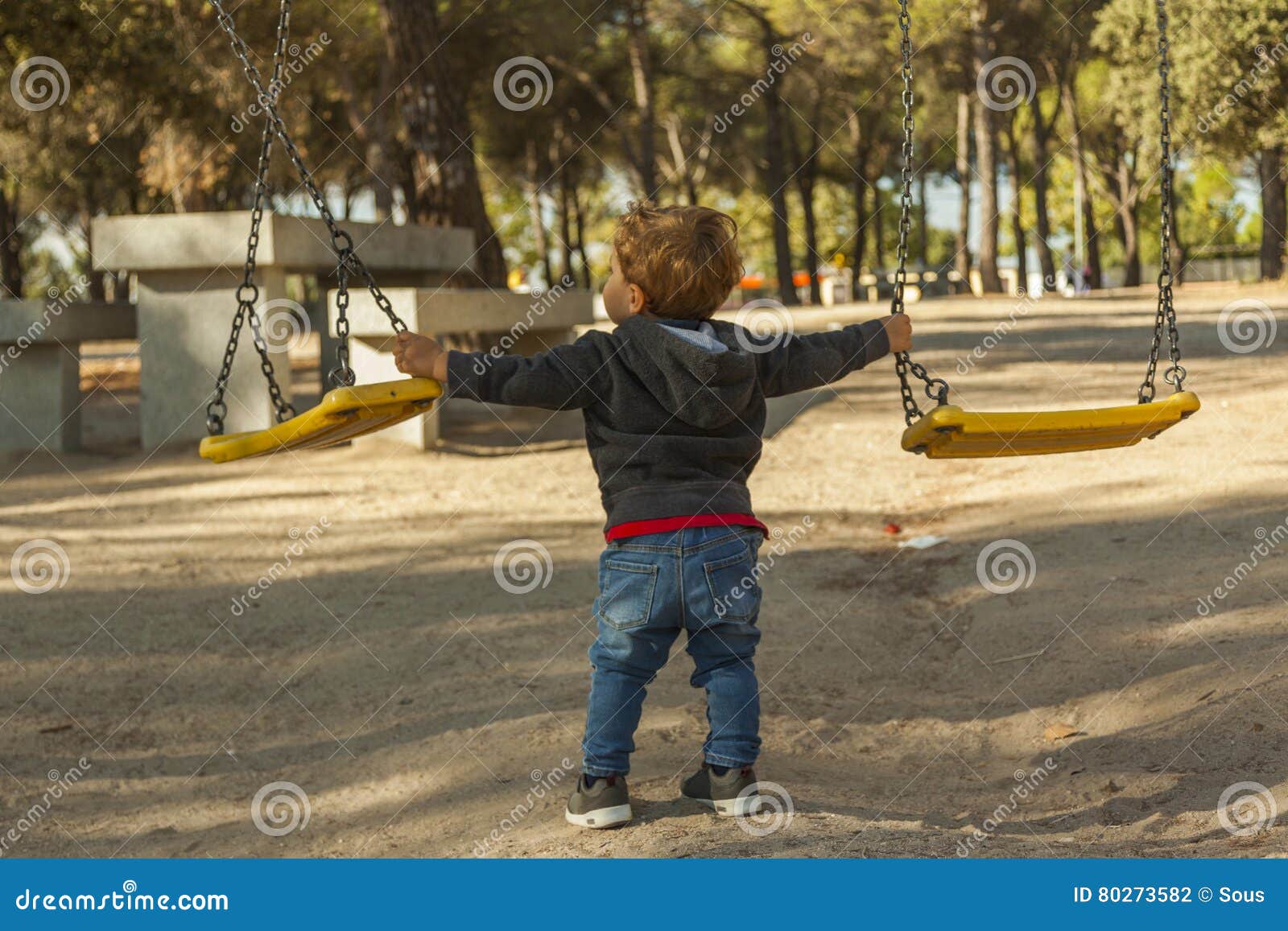 Rear View Boy Having Fun with the Swing at the Playground Stock Photo ...