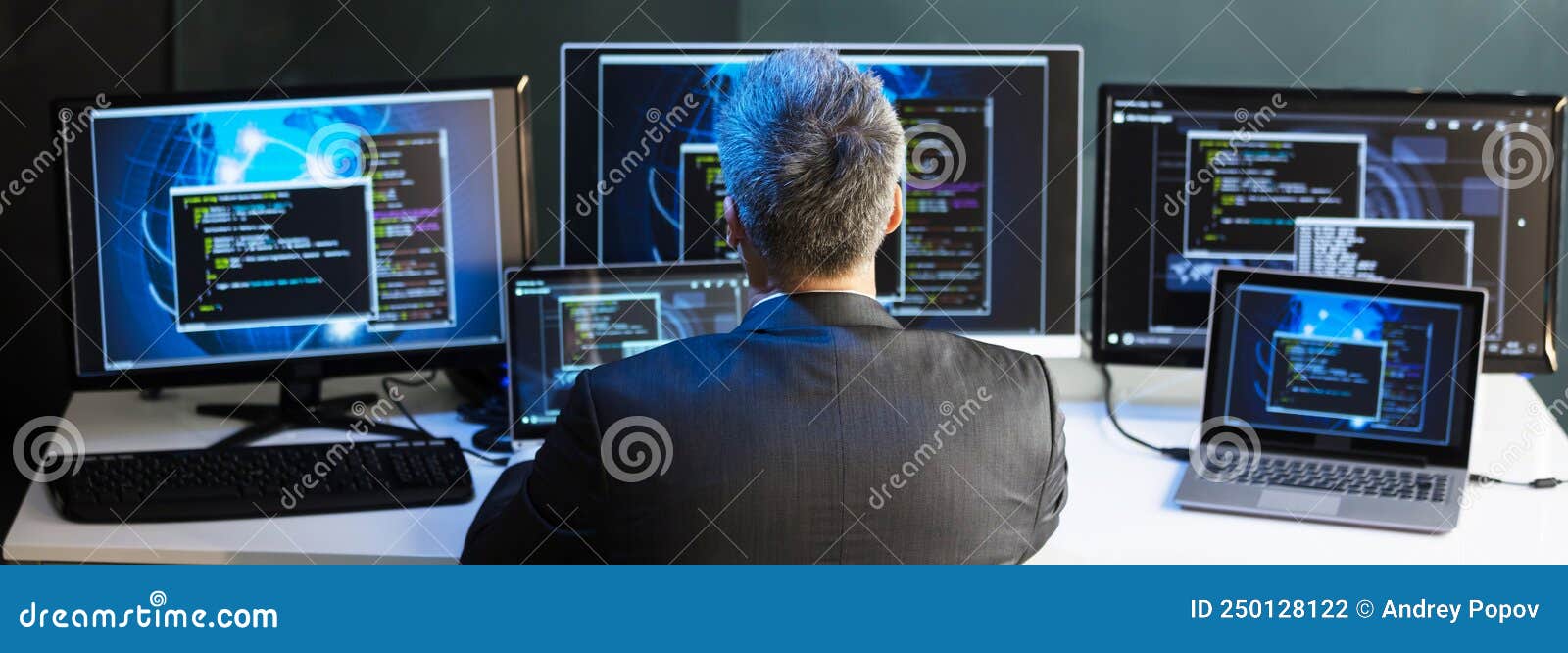 Businessman Looking at Multiple Computer Screens Stock Photo - Image of ...