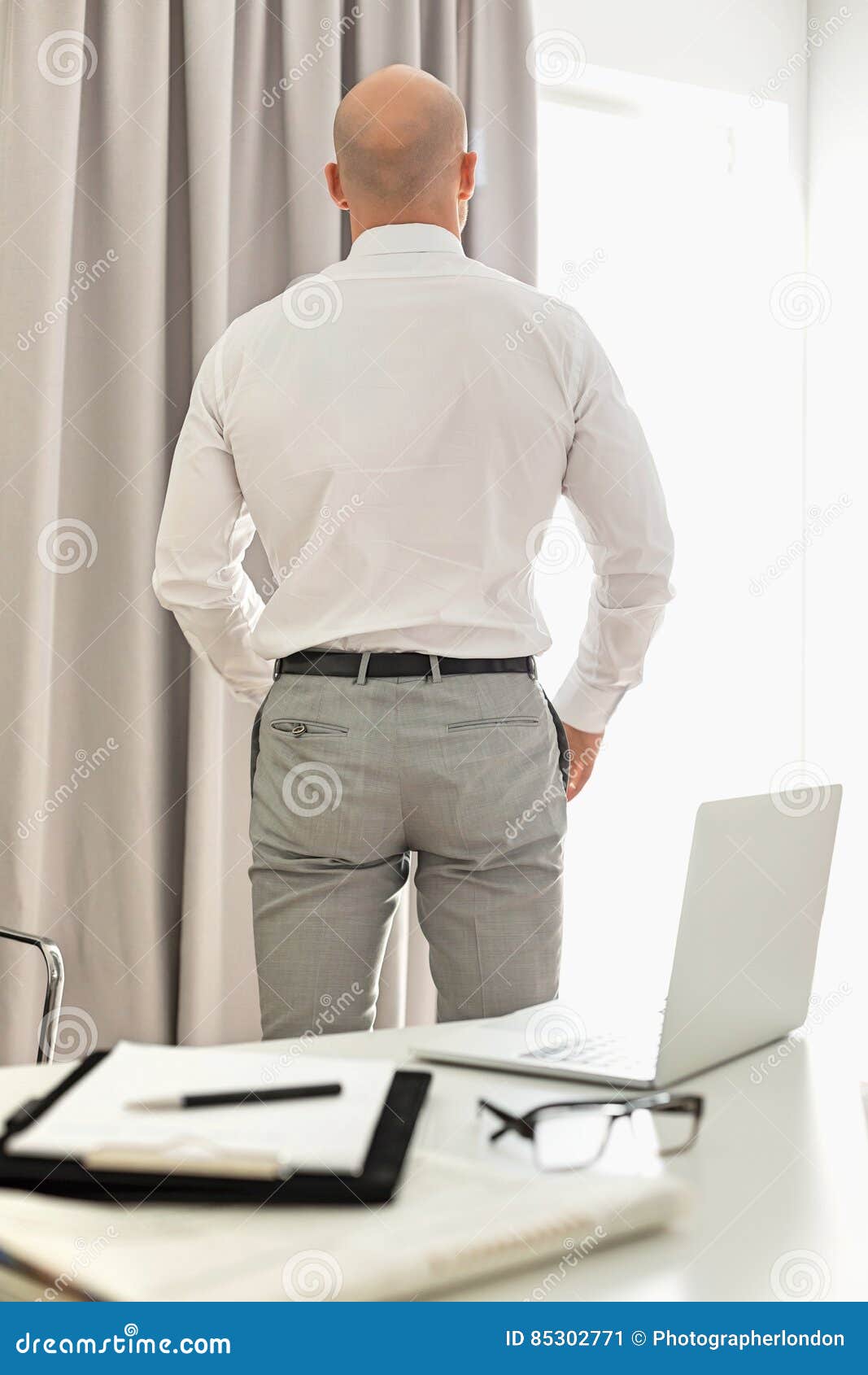 Rear View of Businessman Standing in Home Office Stock Image - Image of ...