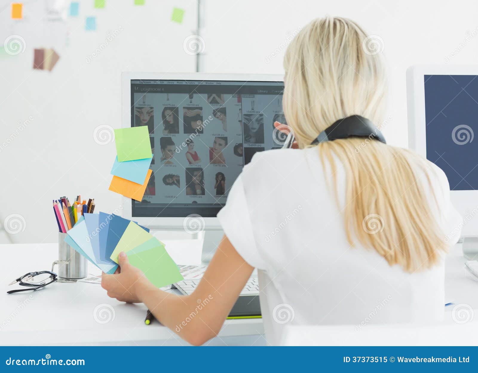 Rear View of a Casual Woman Using Computer in Office Stock Image ...