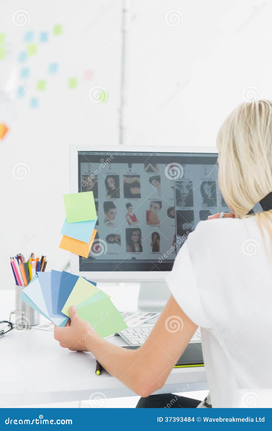 Rear View of Casual Woman Using Computer in Office Stock Photo - Image ...