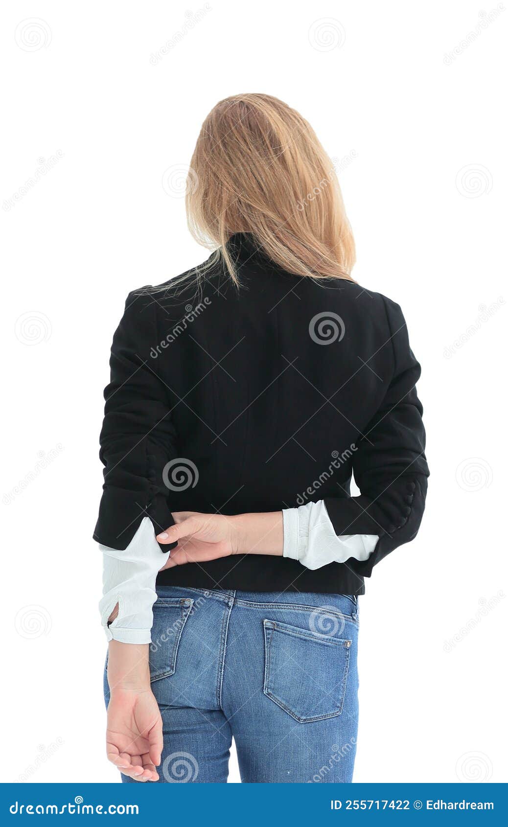 Rear View Confident Young Woman Standing In Front Of A White Wall