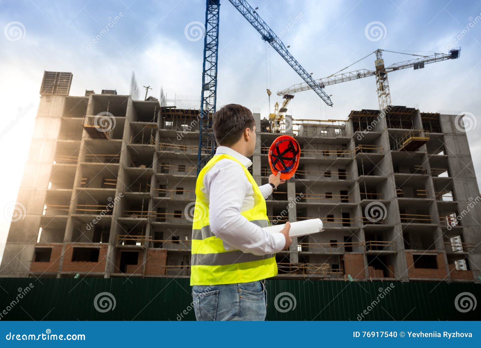 Rear View of Construction Engineer Posing on Building Site at Sunny Sky ...