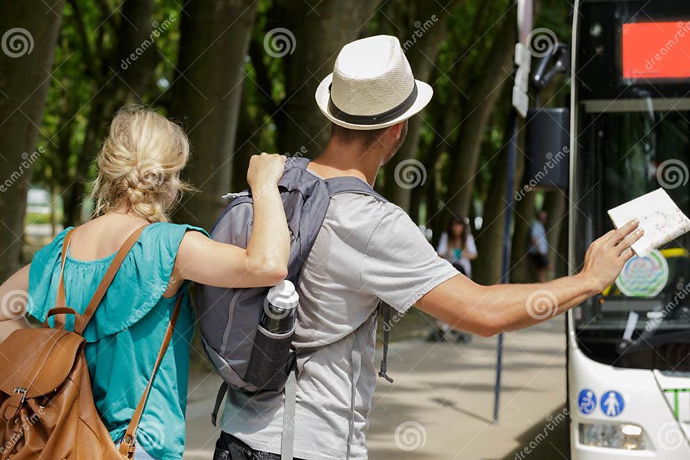 Rear View Couple Flagging Down Bus Stock Photo - Image of flagging ...