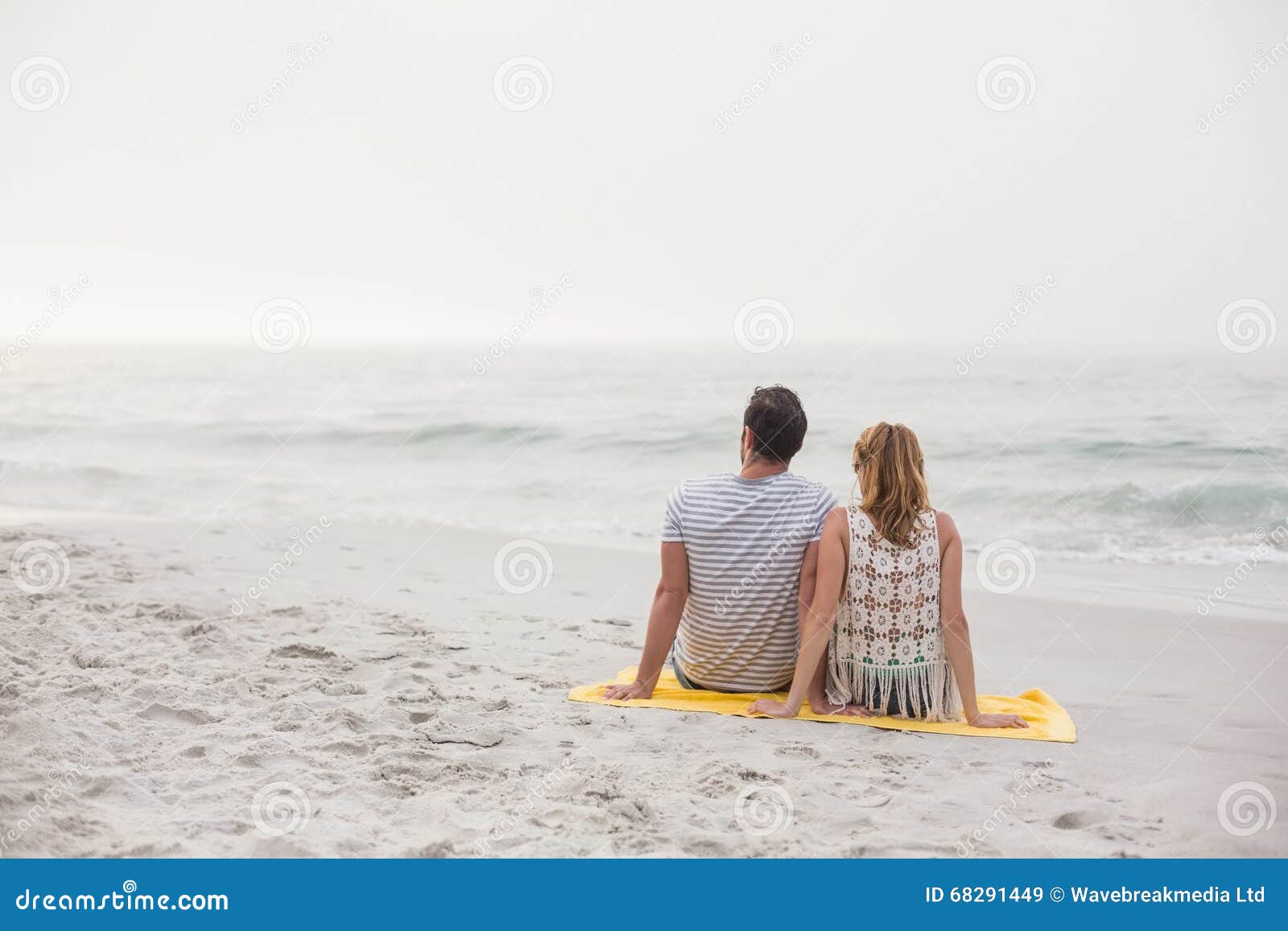 Rear View of Couple Sitting on the Beach Stock Image - Image of romance ...