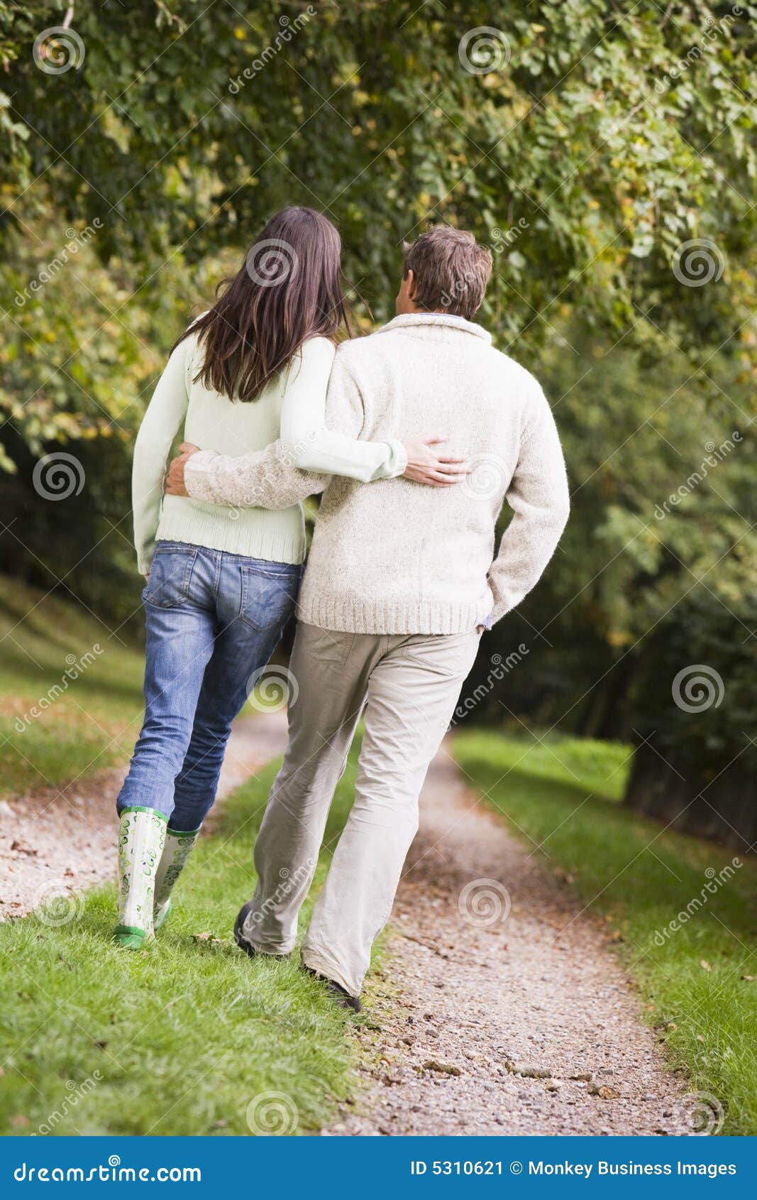 Rear View of Couple Walking Along Path Stock Image - Image of love ...