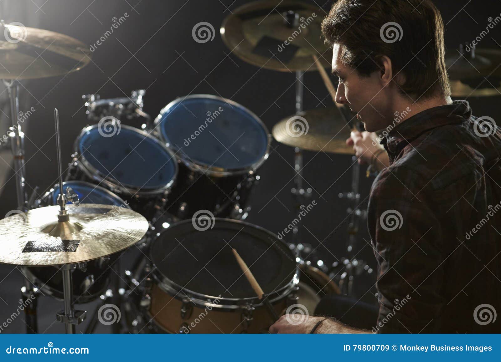 Rear View of Drummer Playing Drum Kit in Studio Stock Image - Image of ...