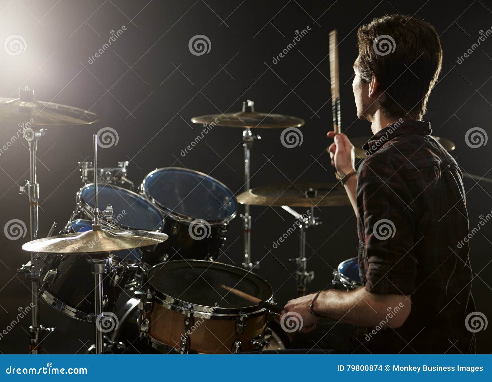 Rear View of Drummer Playing Drum Kit in Studio Stock Photo - Image of ...