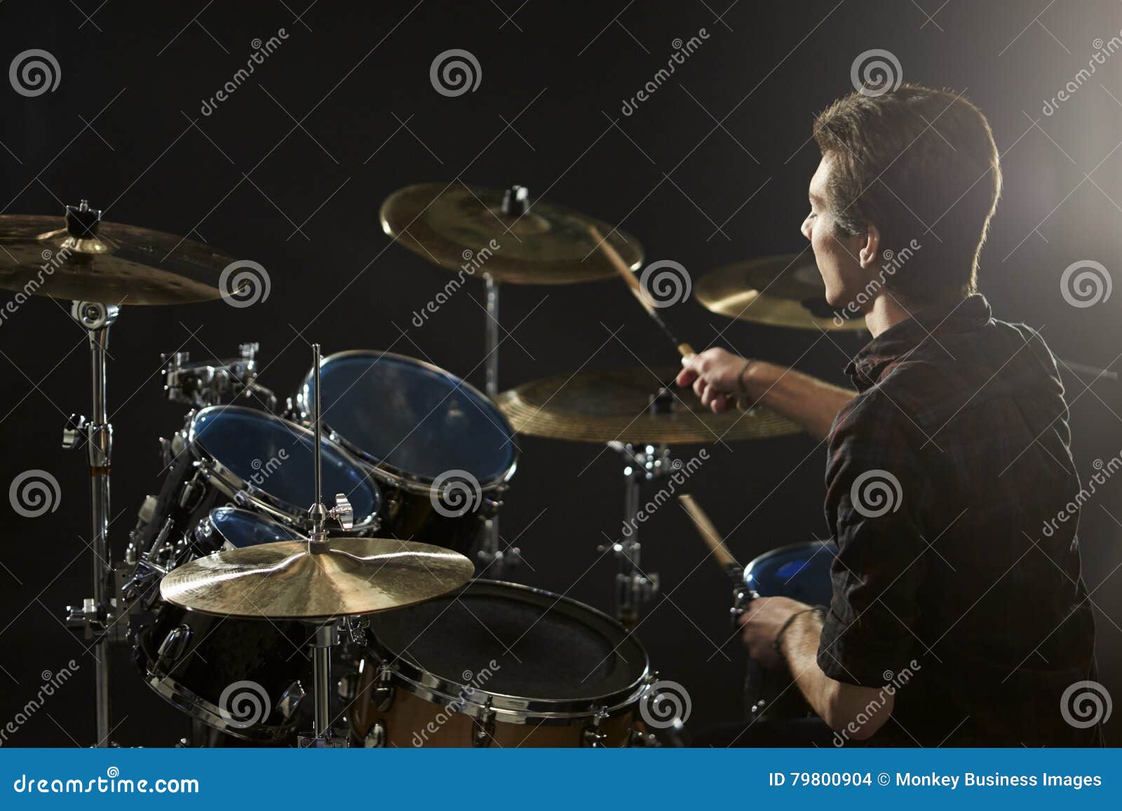 Rear View of Drummer Playing Drum Kit in Studio Stock Photo - Image of ...