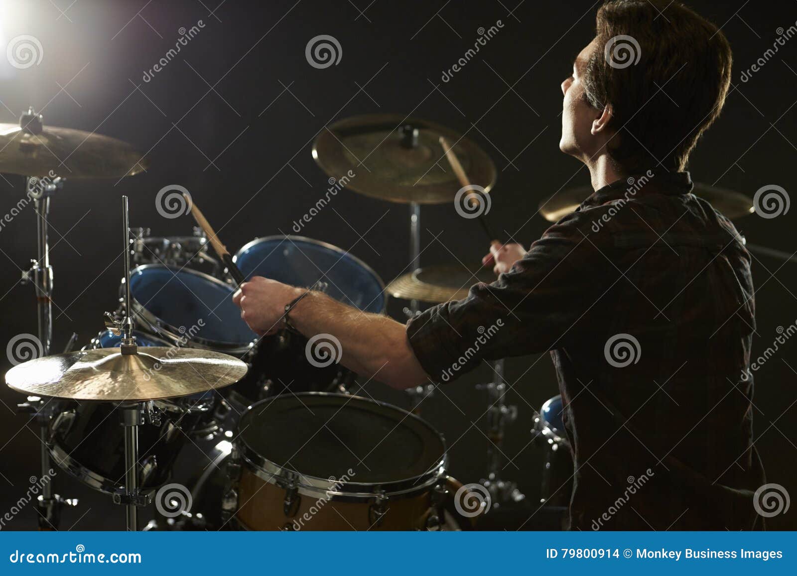 Rear View of Drummer Playing Drum Kit in Studio Stock Photo - Image of ...
