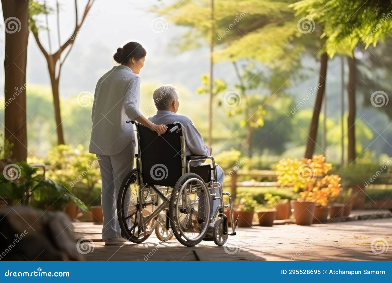 Rear View of Elderly Man in Wheelchair and Care Helper Stock ...