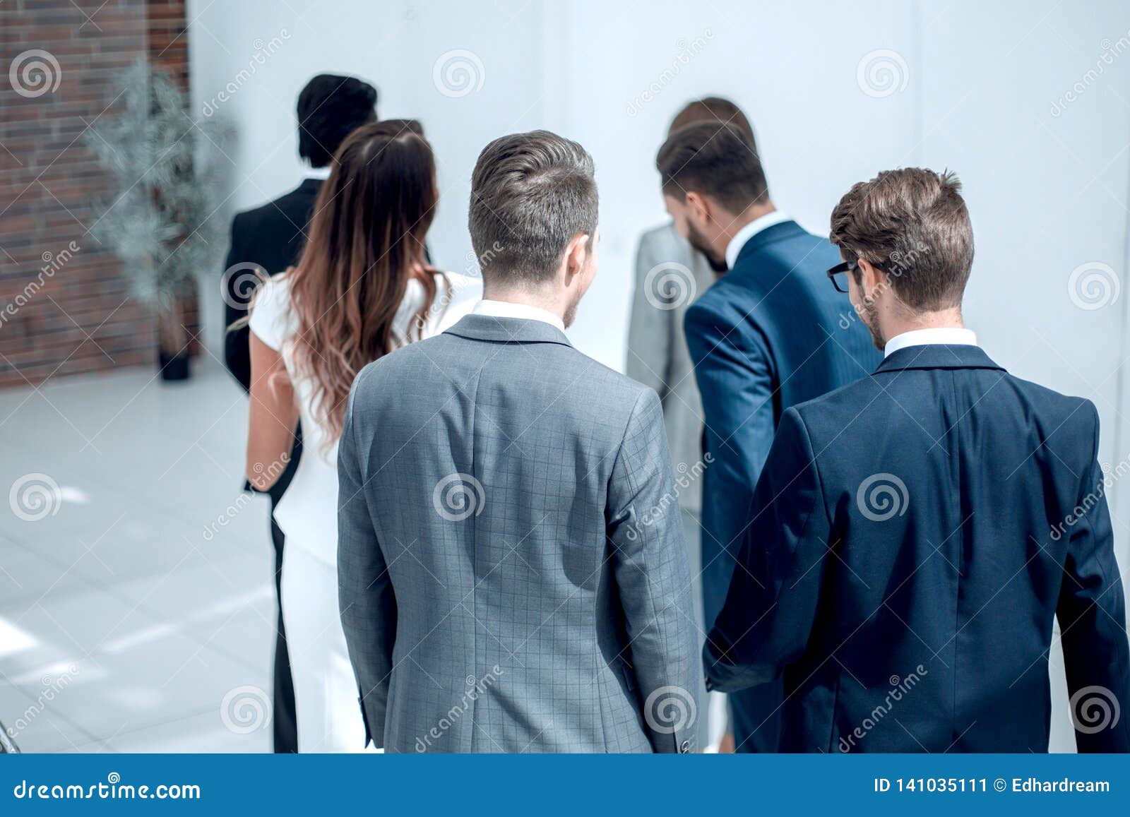 Rear View.employees Standing in a Modern Office Stock Image - Image of ...