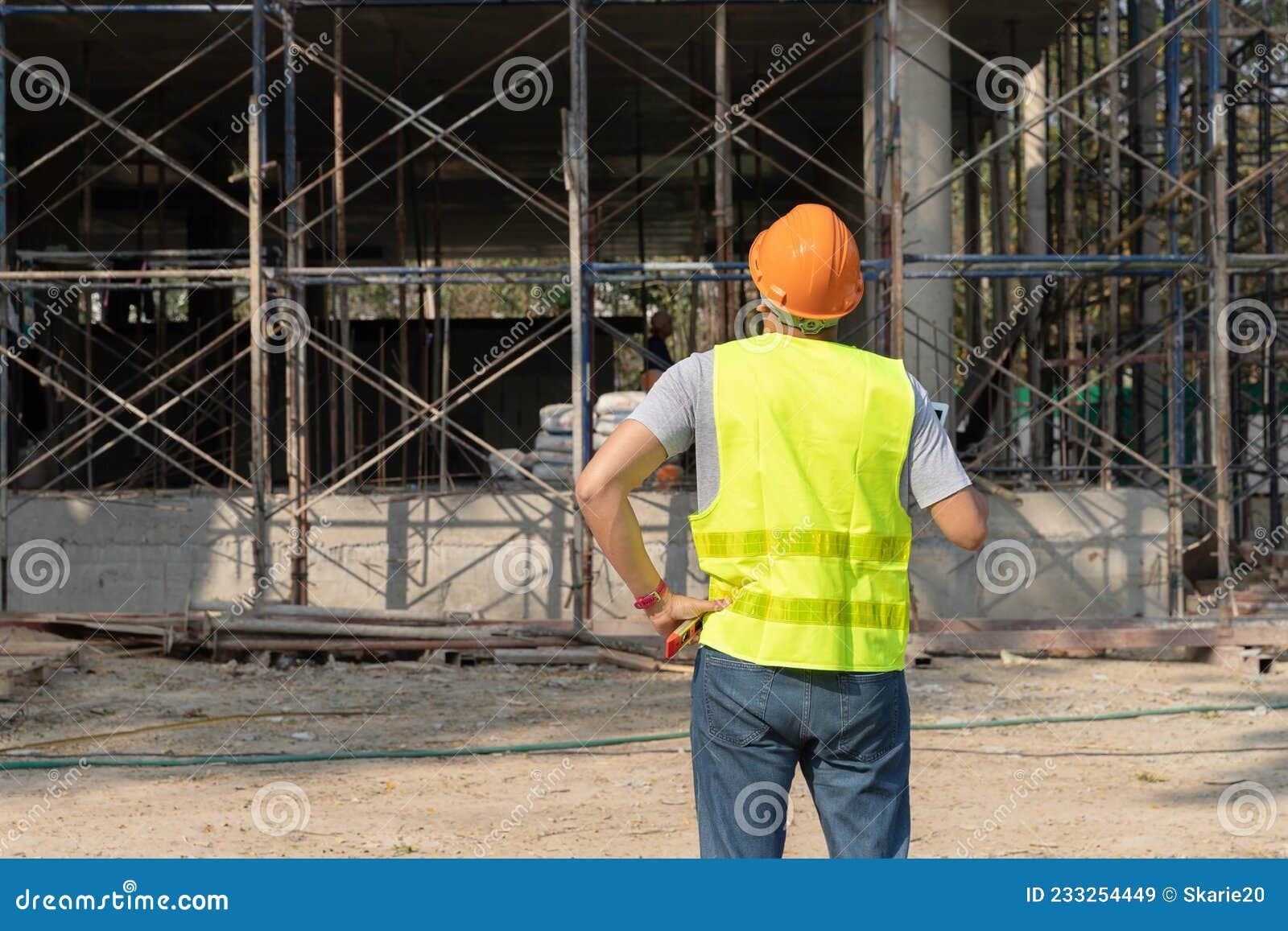 Contractor Standing Looking At Patio Pergola Design Drawing. Stock ...