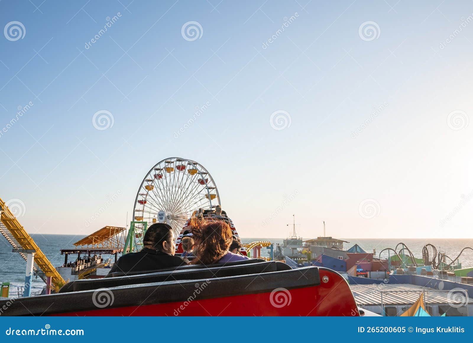 Rear View of Excited Couple Enjoying Roller Coaster Ride at Pacific ... Rear View of Excited Couple Enjoying Roller Coaster Ride at Pacific ...