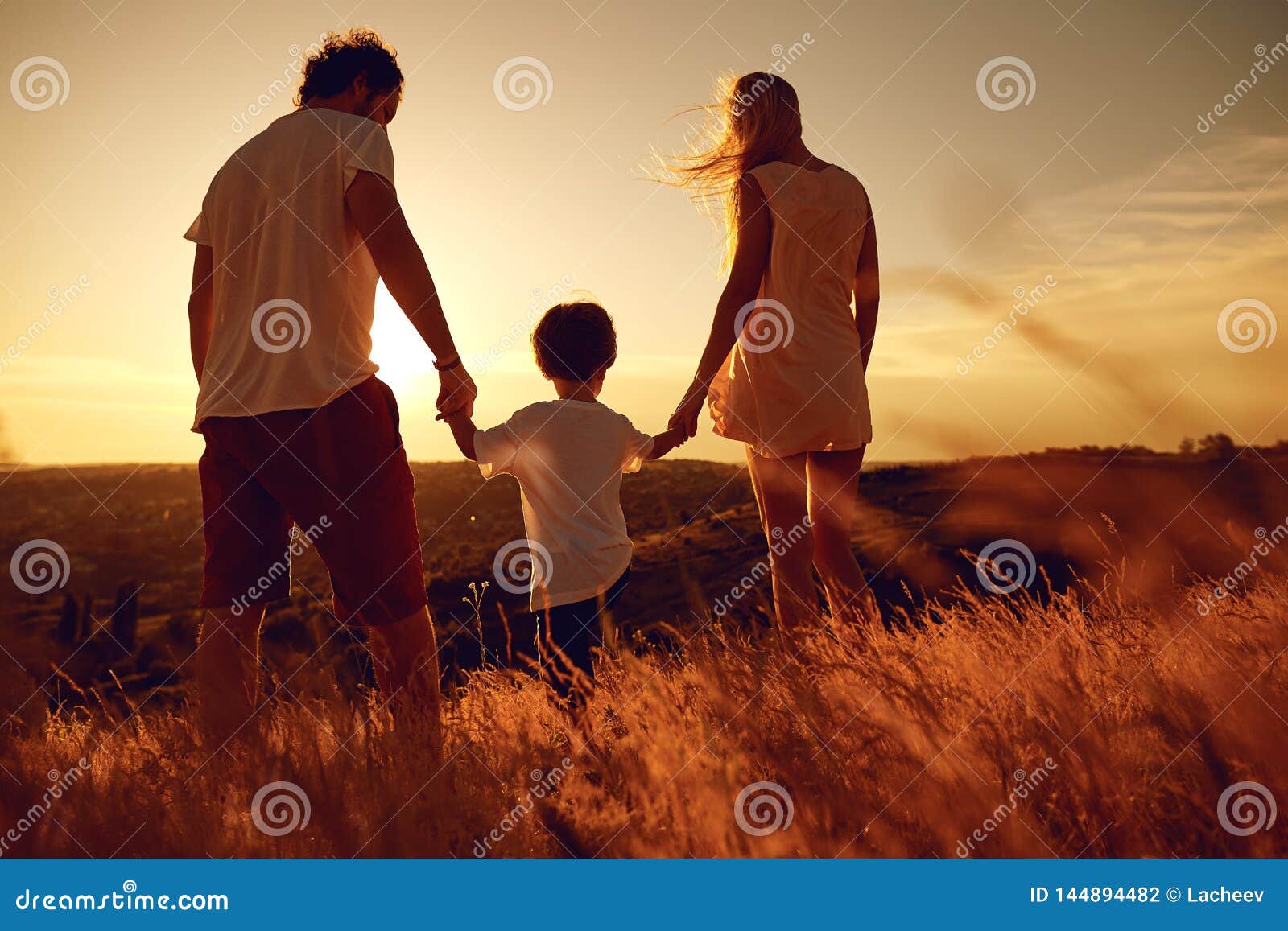 Rear View of Family Standing in Nature at Sunset Stock Photo - Image of ...