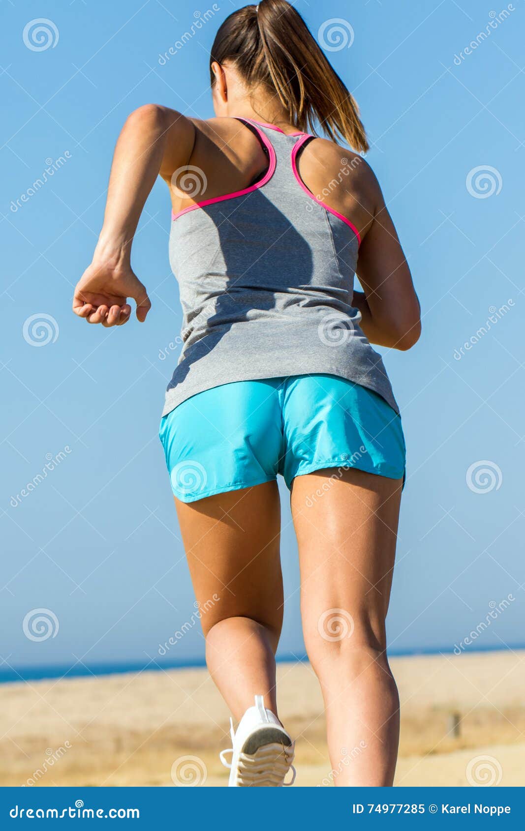 Rear View of Female Runner in Action. Stock Image - Image of female ...