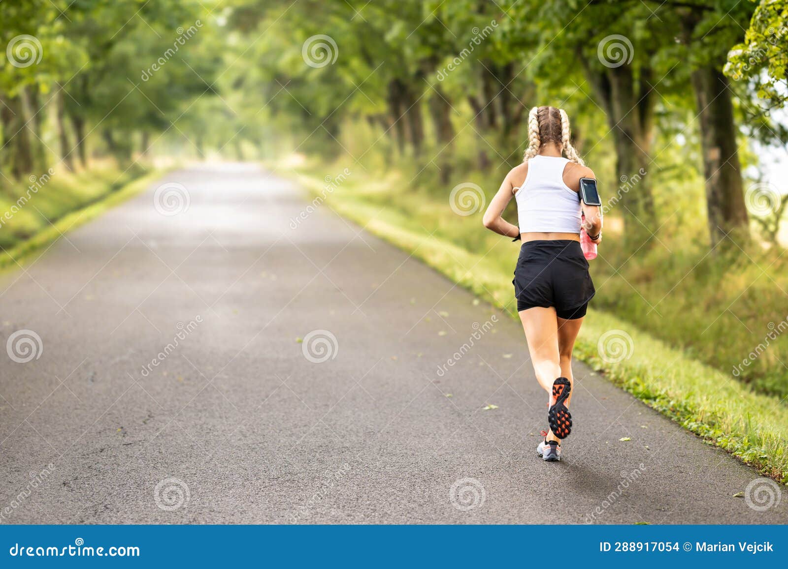 Rear View of a Female Runner Training in Nature Stock Photo - Image of ...