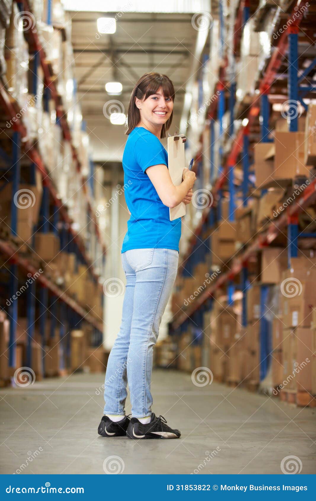 Rear View of Female Worker in Distribution Warehouse Stock Photo ...