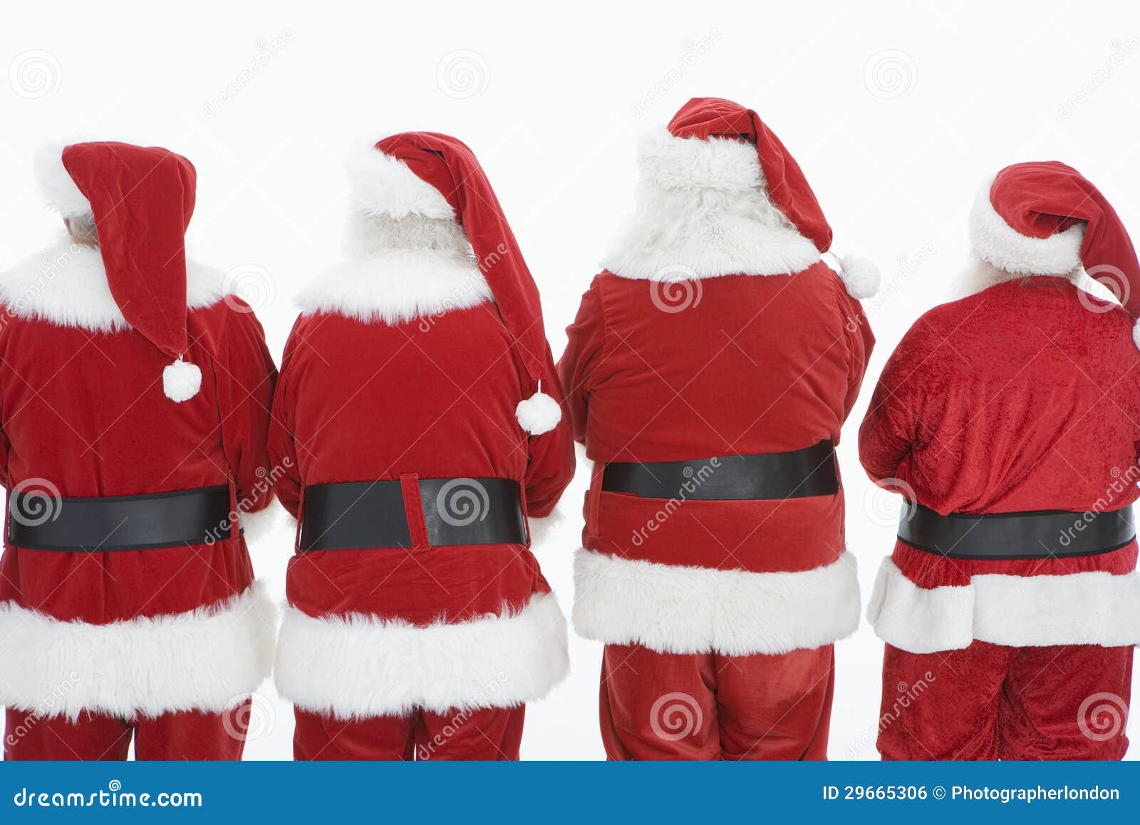 Rear View of Four Men Dressed in Santa Claus Outfits Stock Photo ...