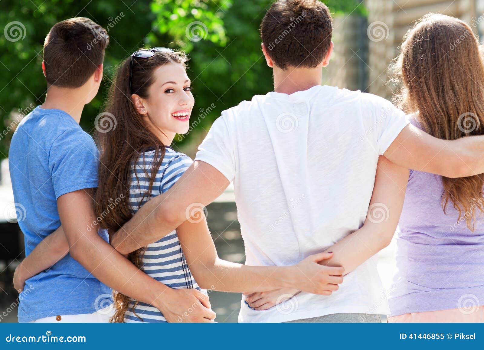 Rear View of Friends Hugging Stock Image - Image of smiling, group ...