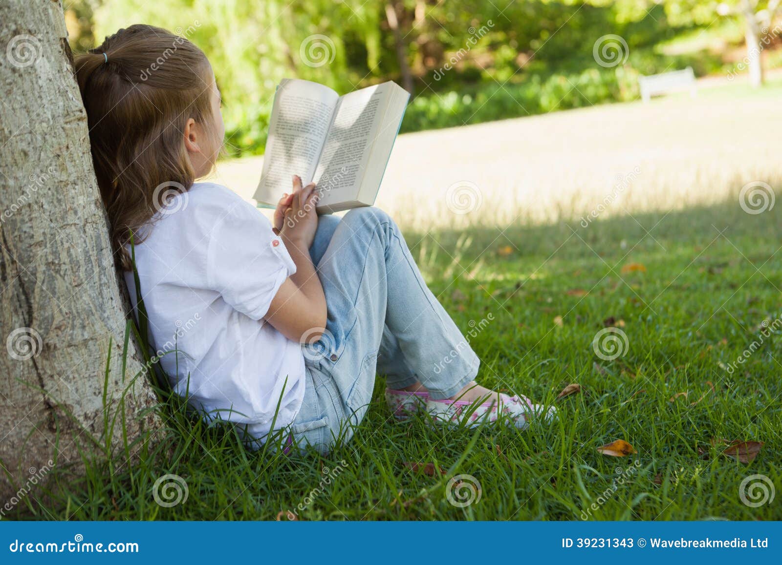 Rear View of Girl Reading Book in Park Stock Image - Image of carefree ...