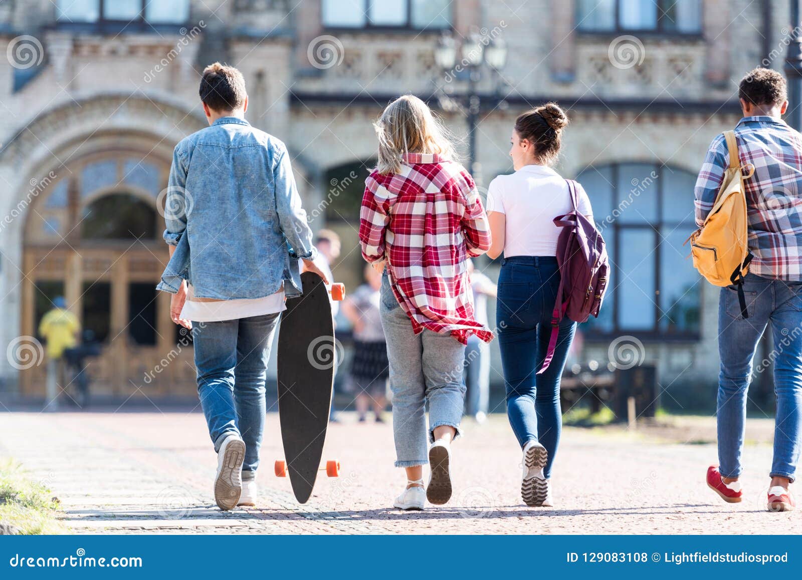Rear View of Group of Teenagers Walking Stock Photo - Image of ...