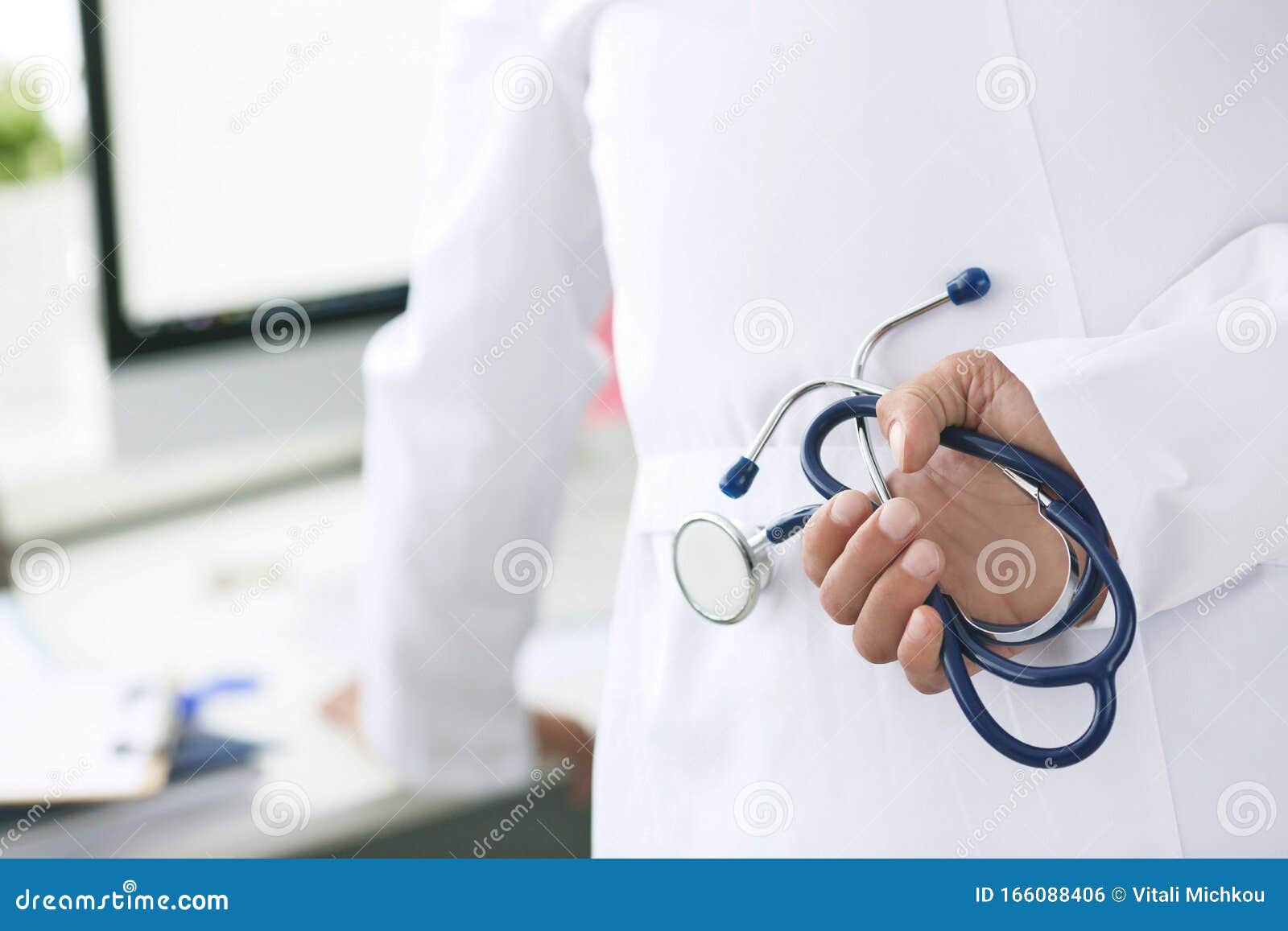 Rear View Image of Doctor with Arms Behind Back Holding Stethoscope and ...