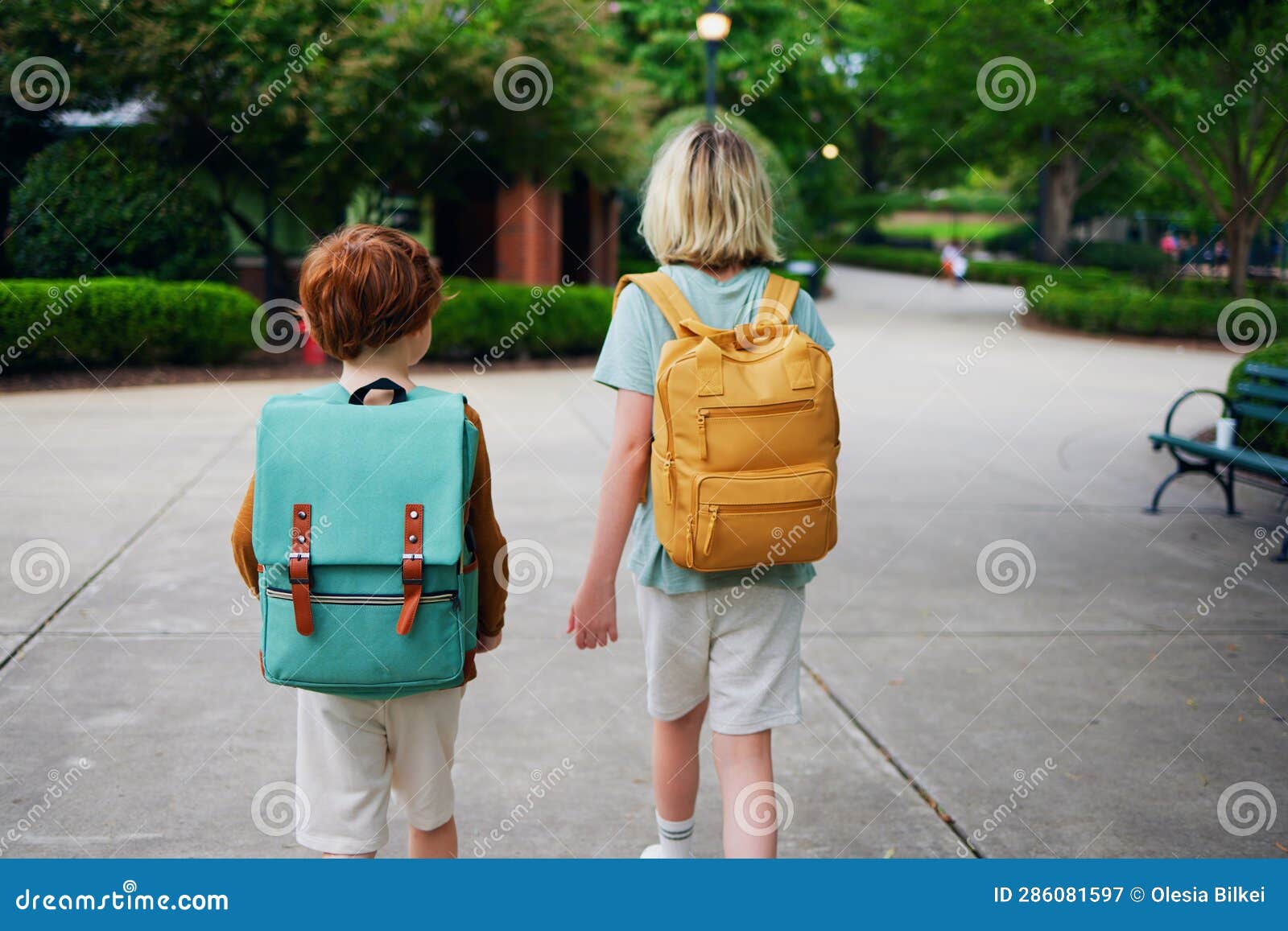 Rear View of Kids with Backpacks Walking from School Stock Image ...