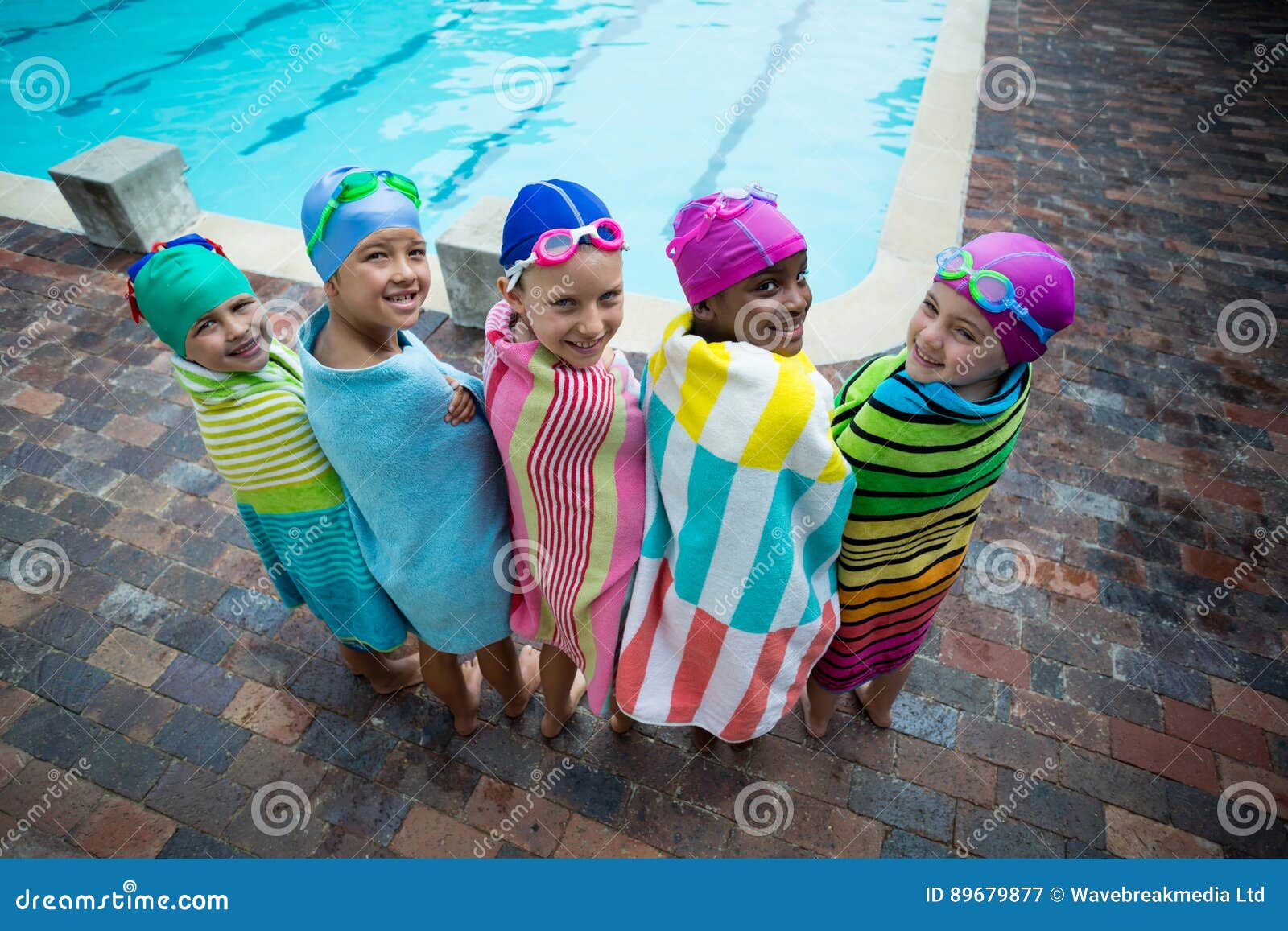 Rear View of Little Swimmers Wrapped in Towels at Poolside Stock Image ...