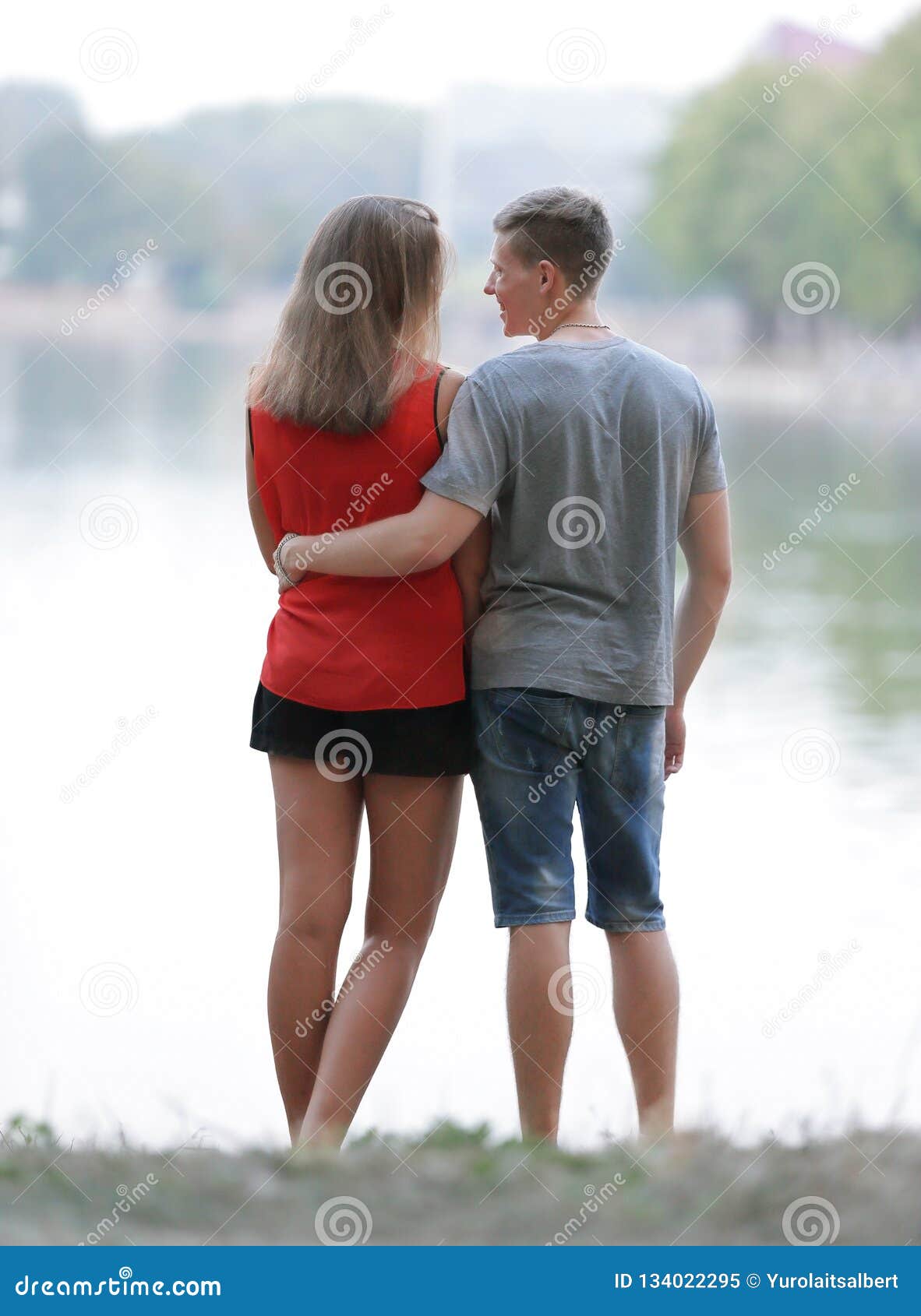 Rear View.in Love Young Couple Looking at the Lake Stock Image - Image ...