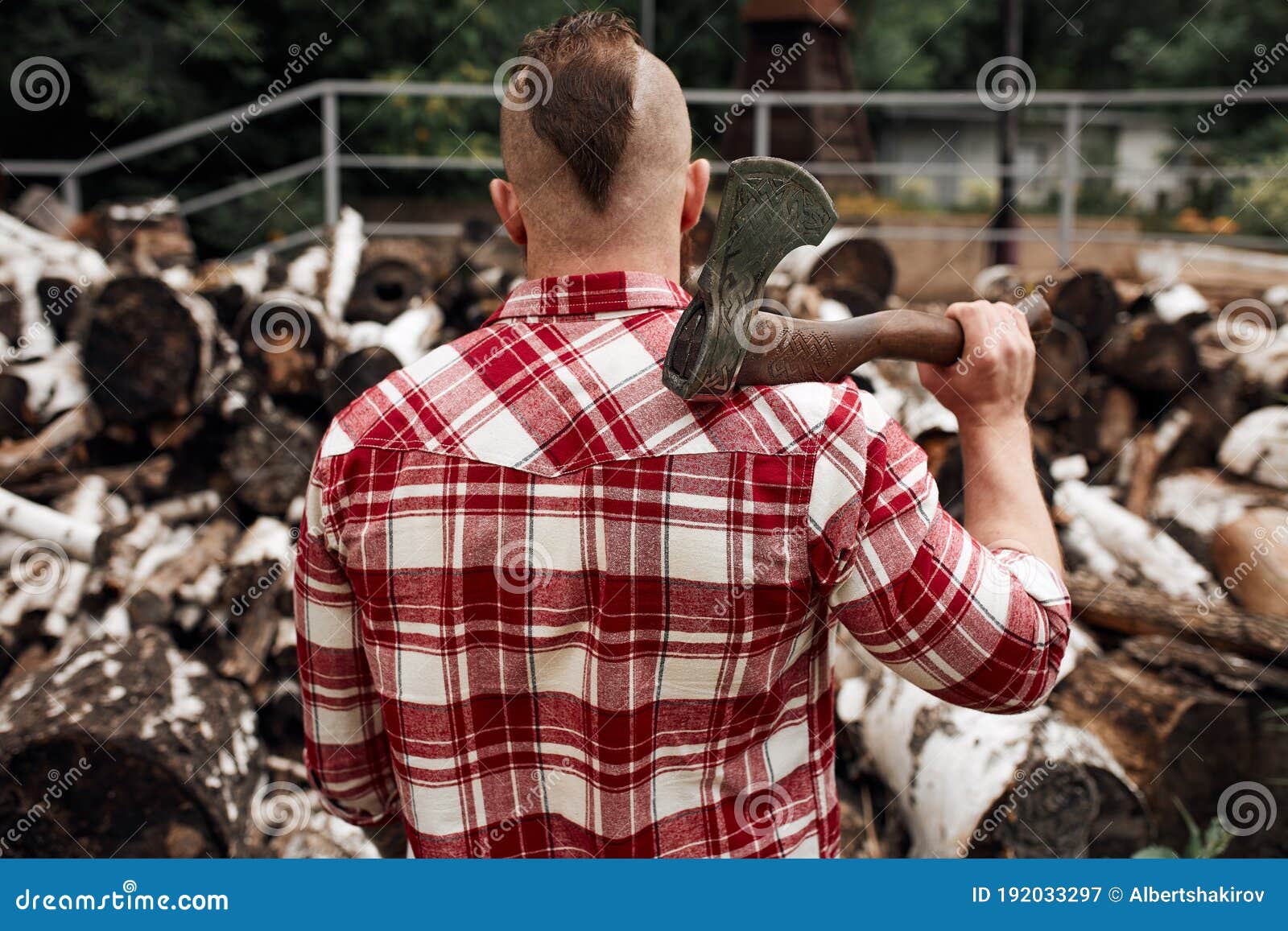Rear View of Lumberjack in Forest Holding an Axe on His Shoulder Stock ...