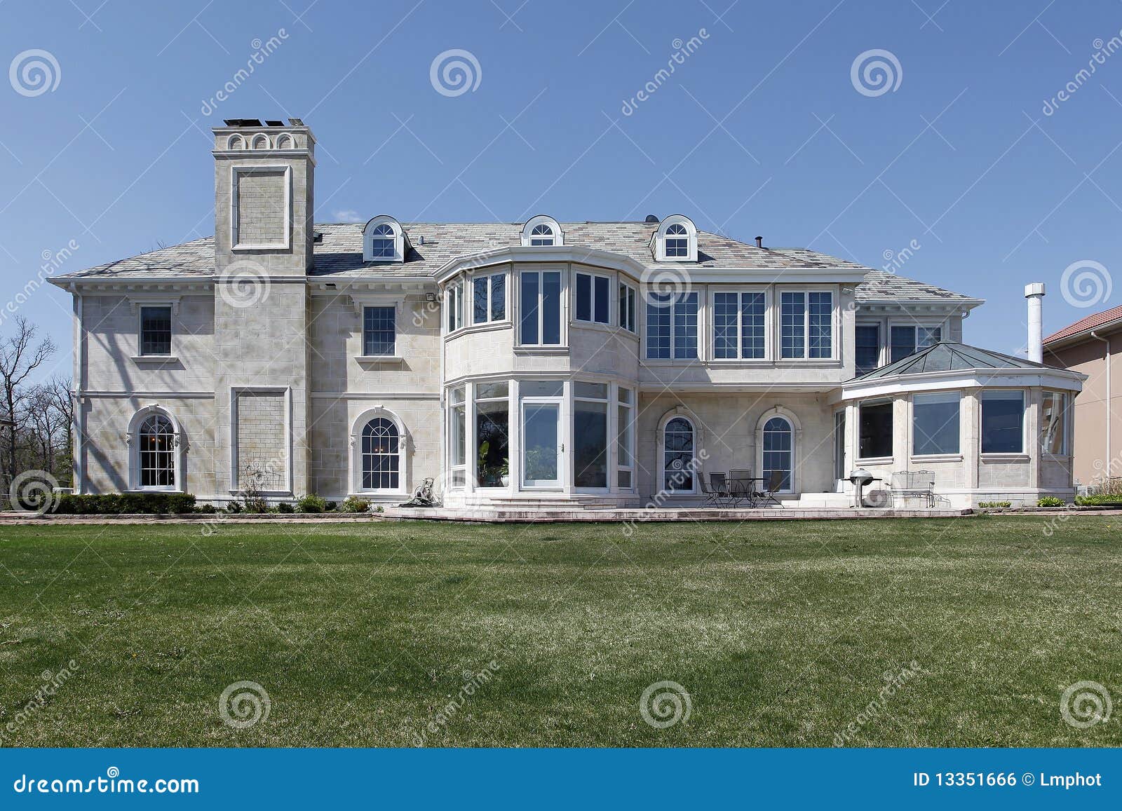 Rear view of luxury home stock photo. Image of landscaping - 13351666