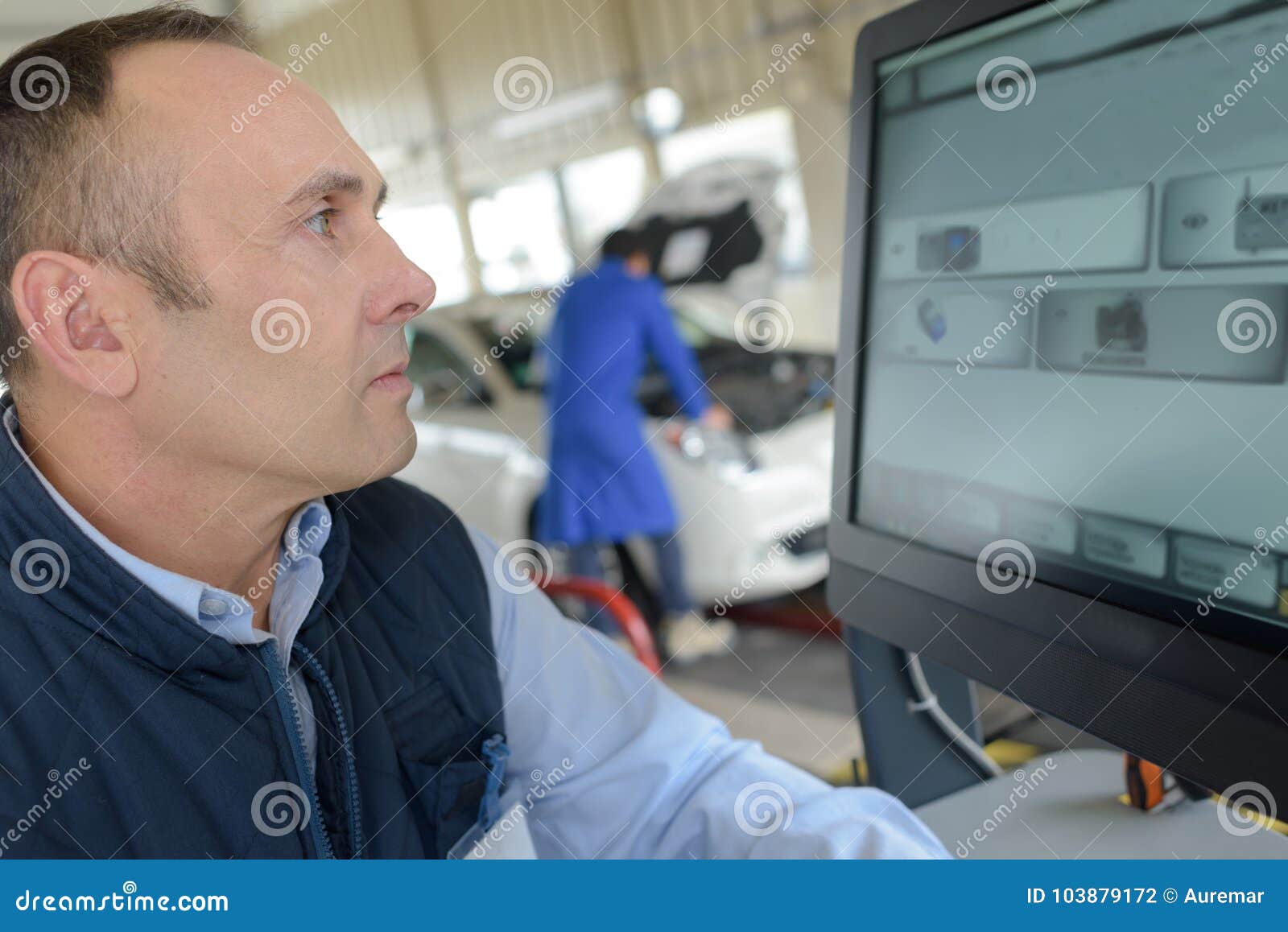 Rear View Male Mechanic Using Computer in Garage Stock Photo - Image of ...