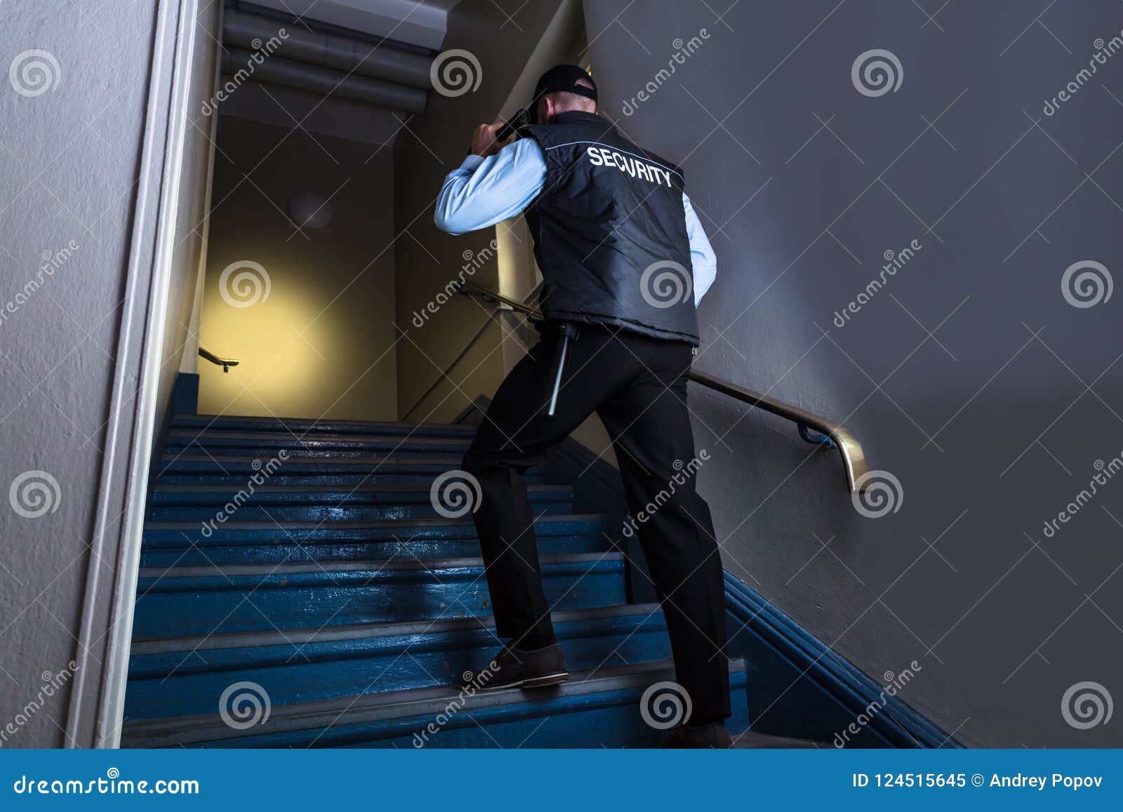 Male Security Guard In Uniform With Portable Radio Transmitter And ...