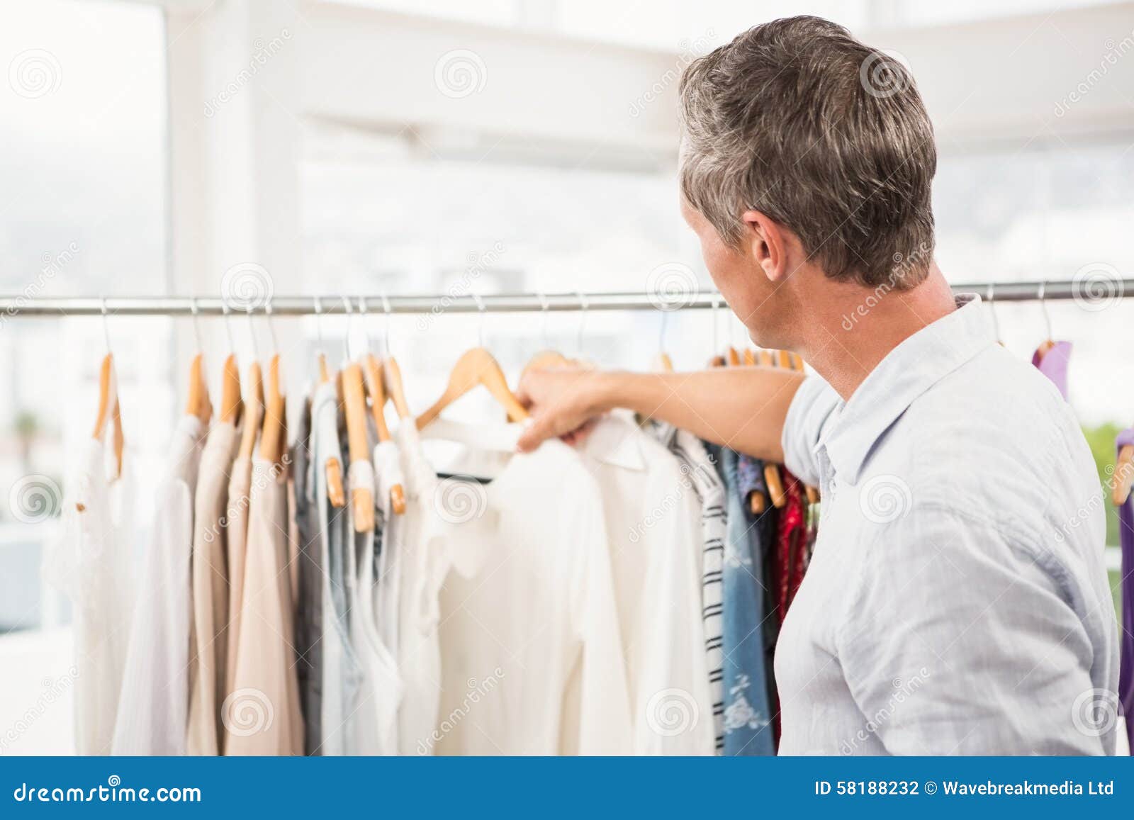 Rear View of Man Browsing Clothes Stock Photo - Image of boutique ...
