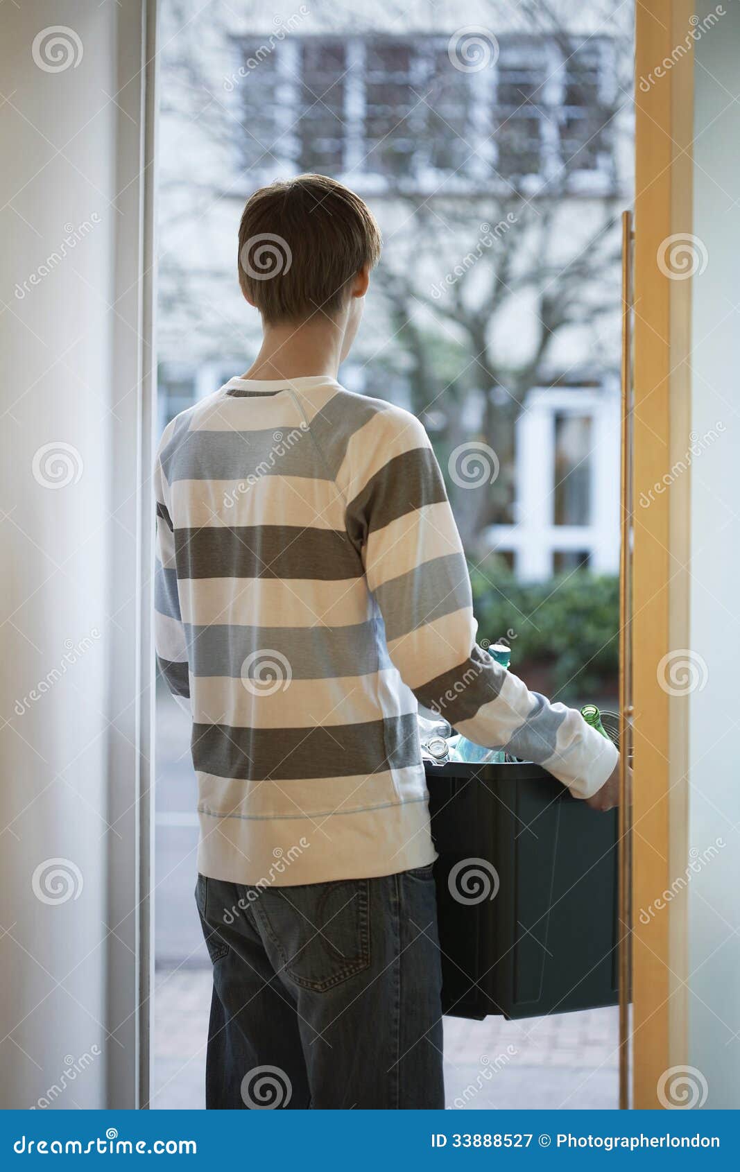 Rear View of Man Carrying Garbage Container Stock Image - Image of ...