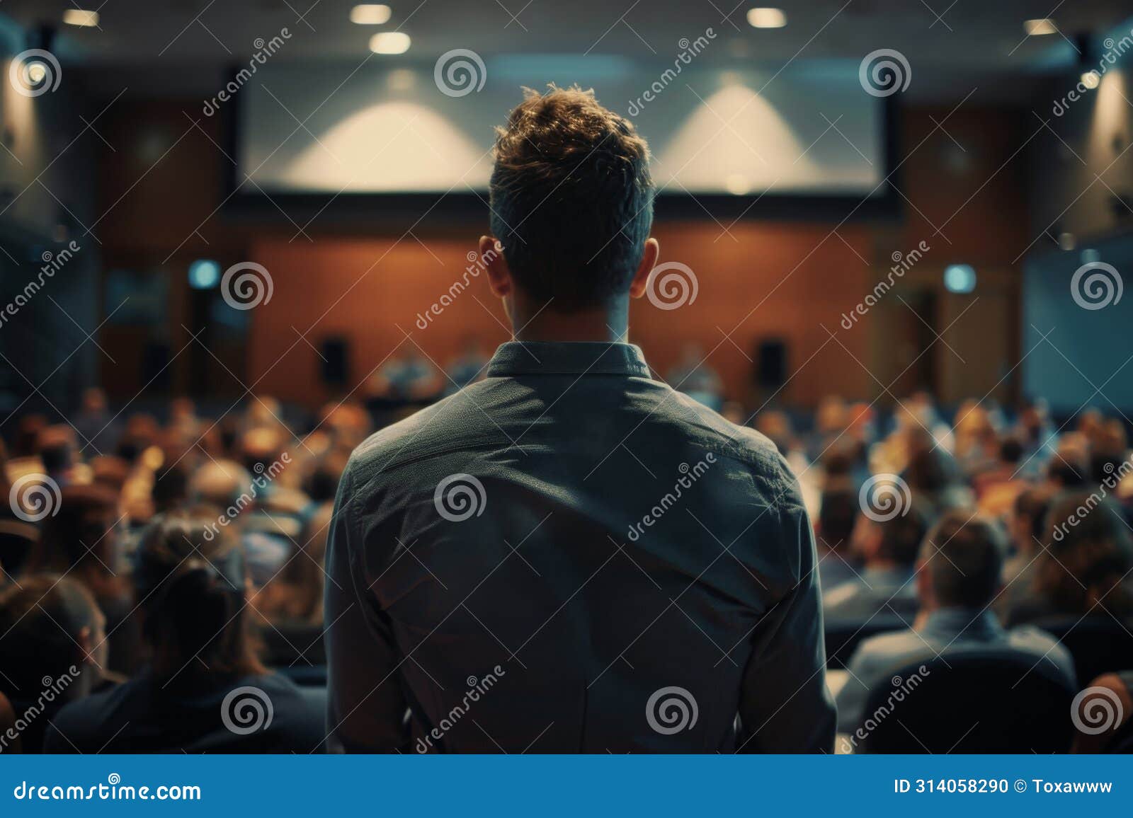 Rear View of a Man at a Crowded Conference Presentation Stock Photo ...