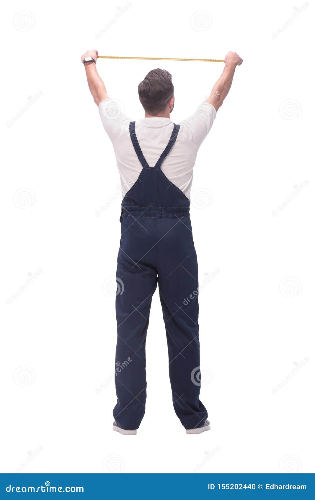 Rear View. a Man Measuring Something with a Construction Tape Measure ...