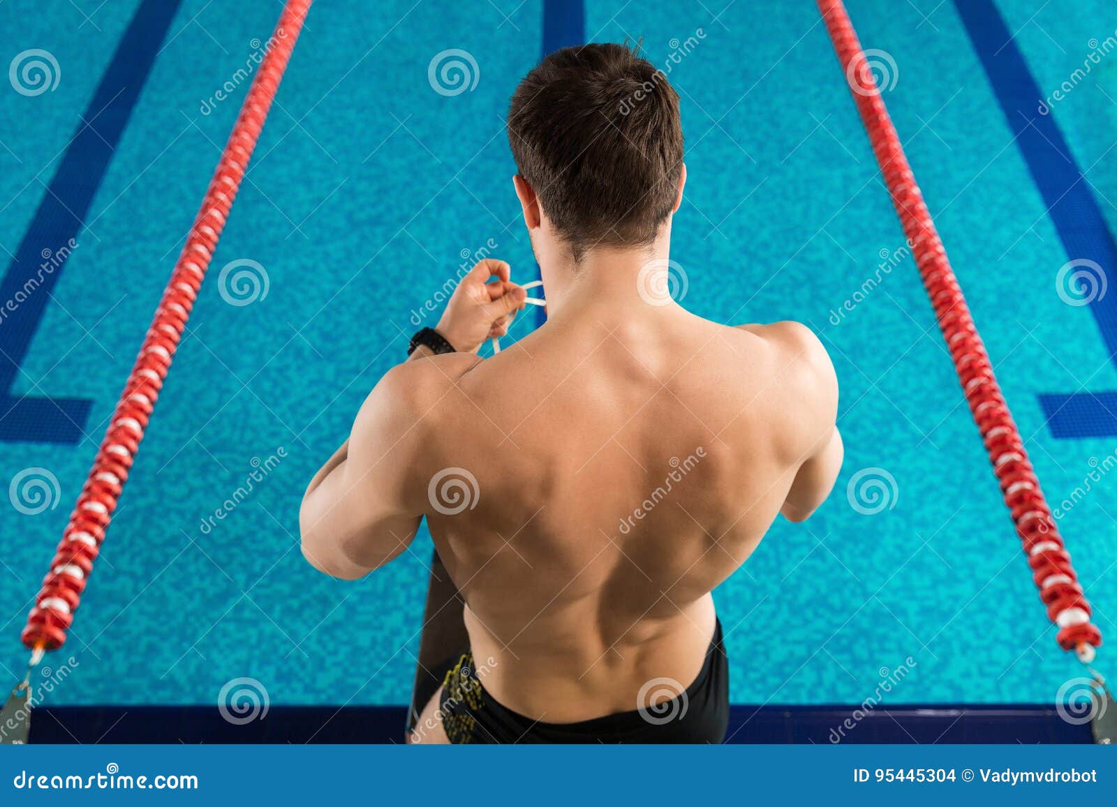 Rear View of a Man Preparing Swimming Goggles Stock Photo - Image of ...