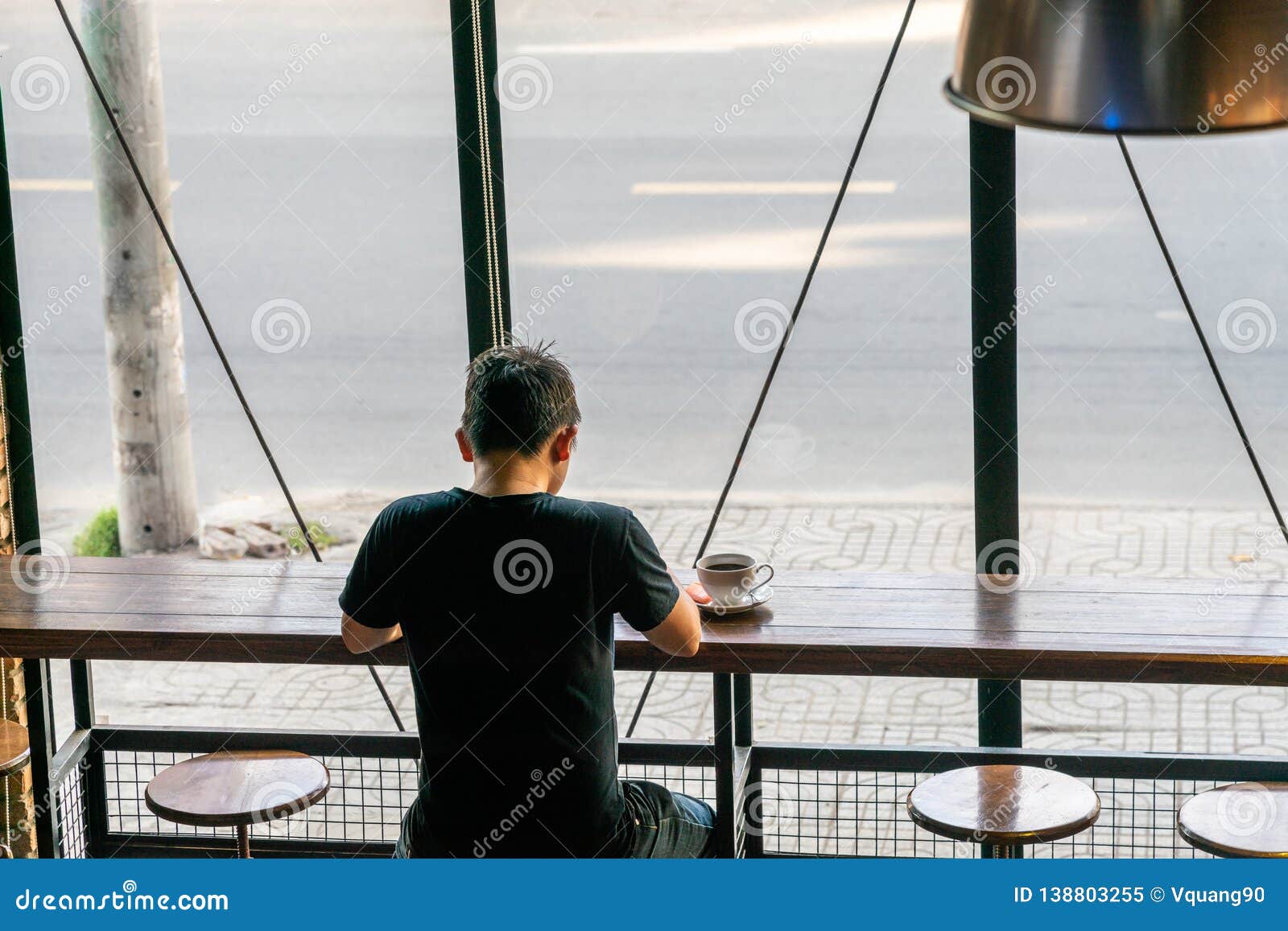 Rear View of Man Reading Book in a Cafe Stock Image - Image of research ...