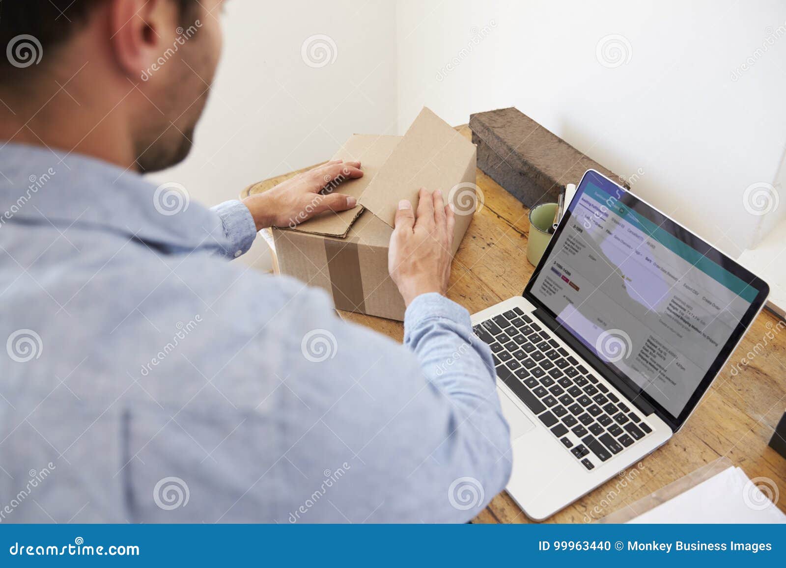 Rear View of Man Running Business from Home Dispatching Goods Stock ...