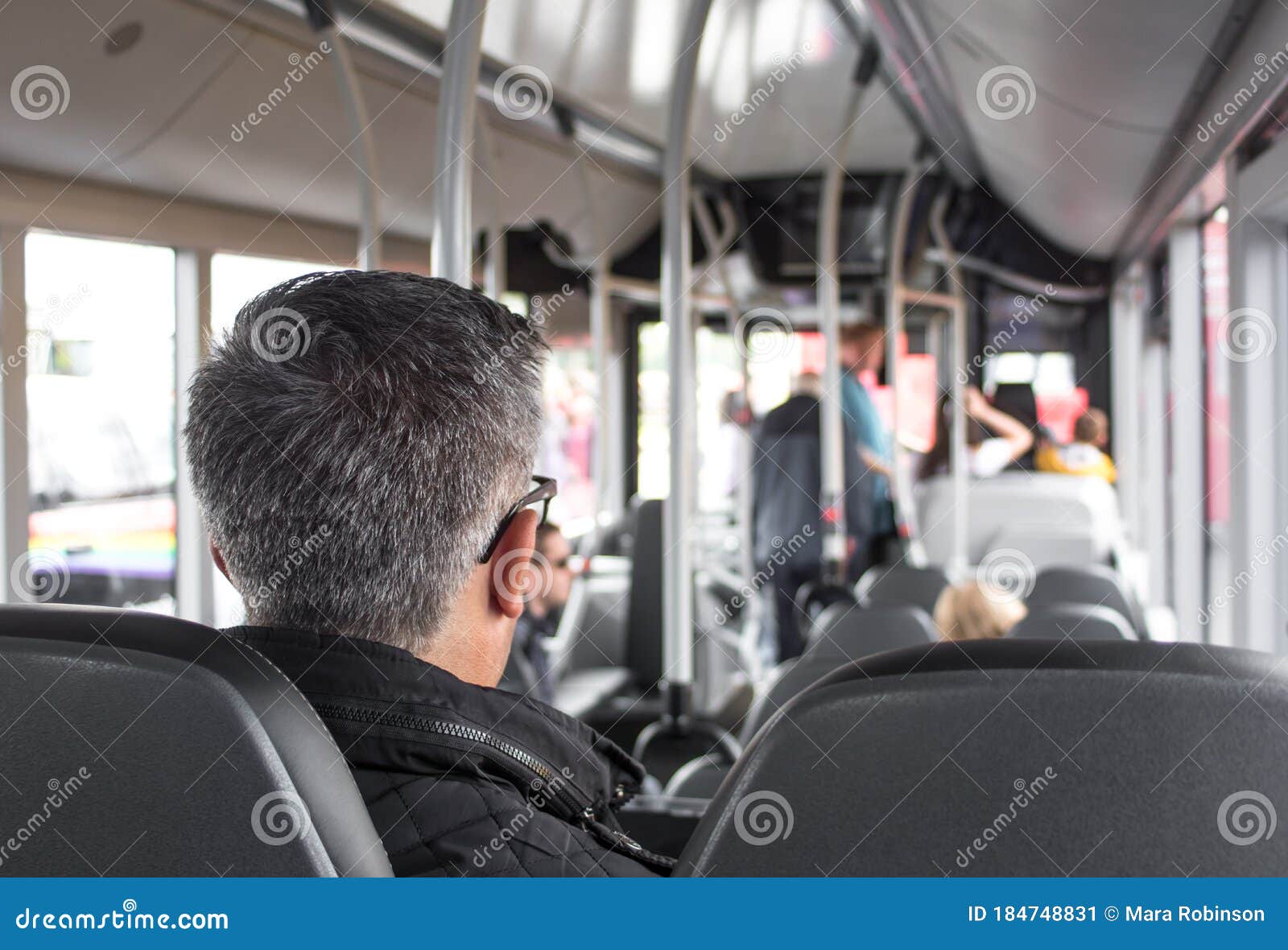 Rear View of Man Sitting in a Seat on a Public Bus Editorial Photo ...
