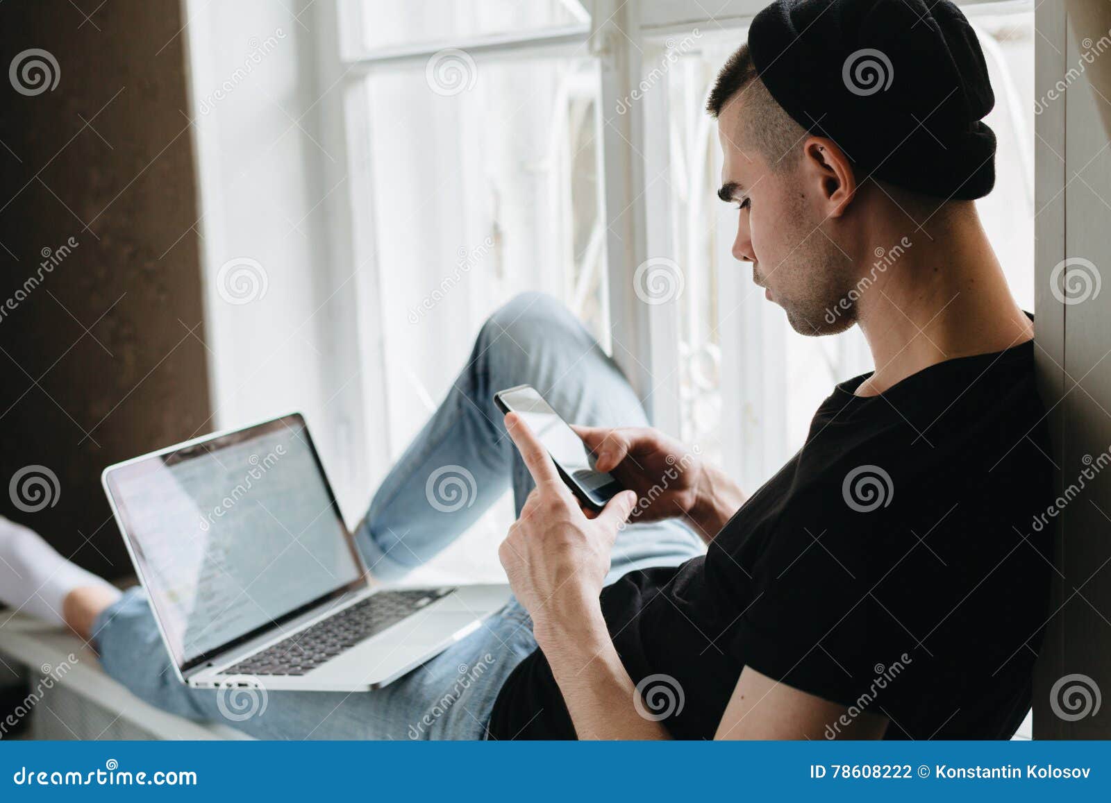 Rear View of Man Using Cellphone and Laptop Stock Photo - Image of ...