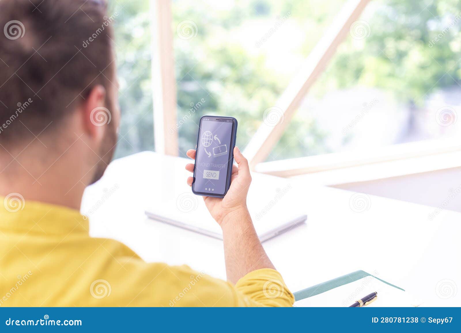Rear View of a Man Using Mobile Phone and Transfer Money Stock Photo ...
